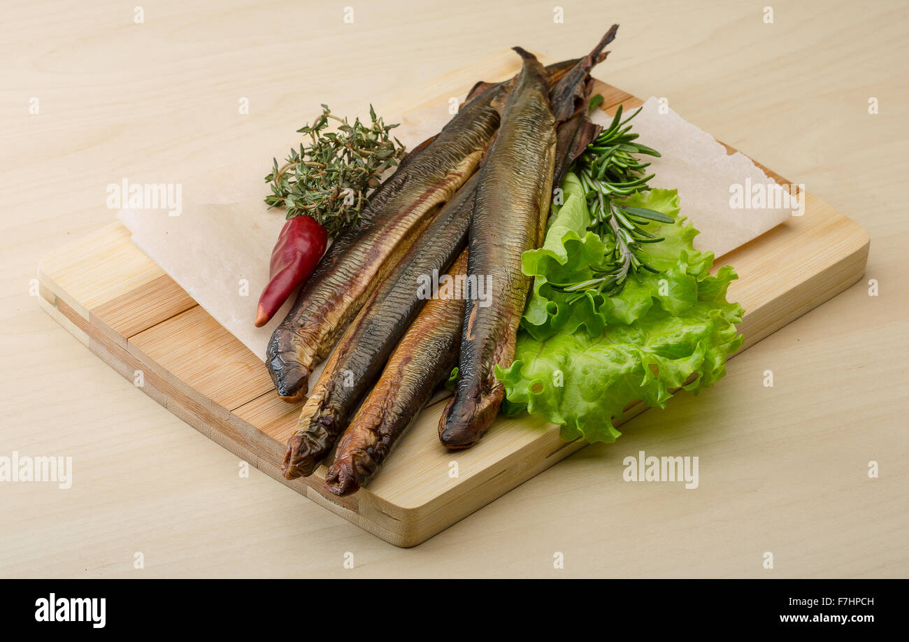 Smoked Lamprey - seafood delicacy with salad and herbs Stock Photo - Alamy