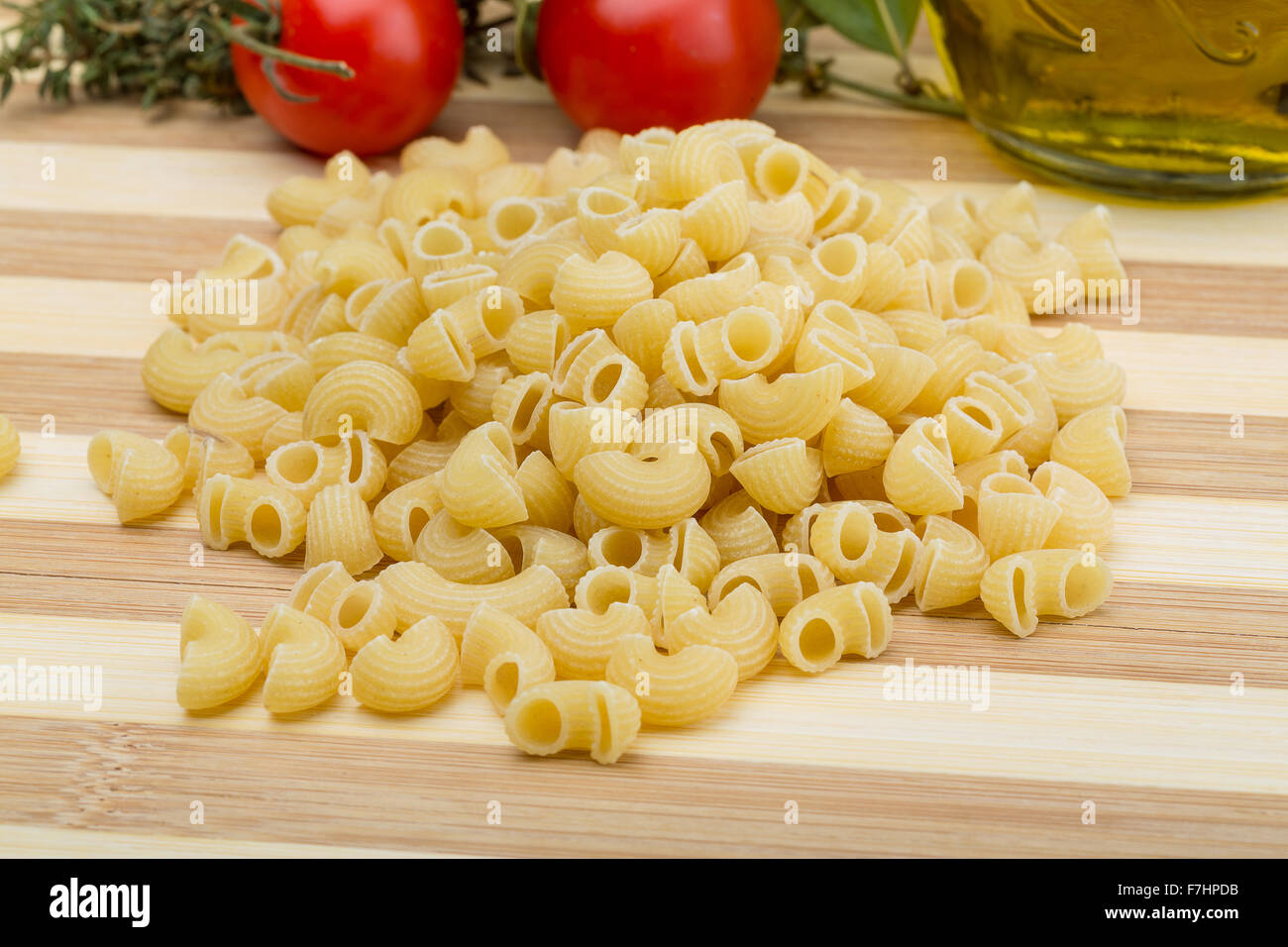 Pipe rigate pasta on the wood background Stock Photo - Alamy