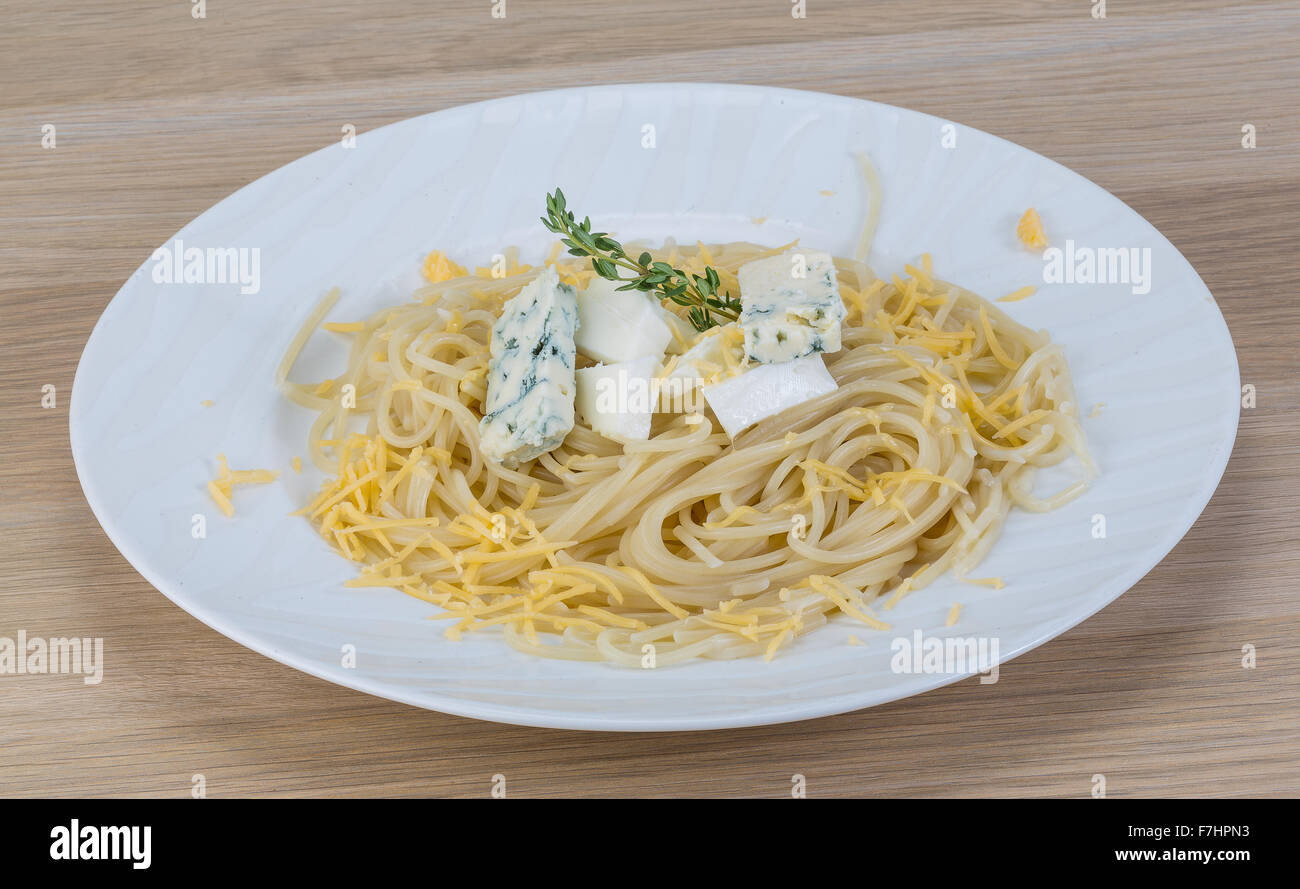Spaghetti with blue, soft and parmesan cheeses Stock Photo - Alamy