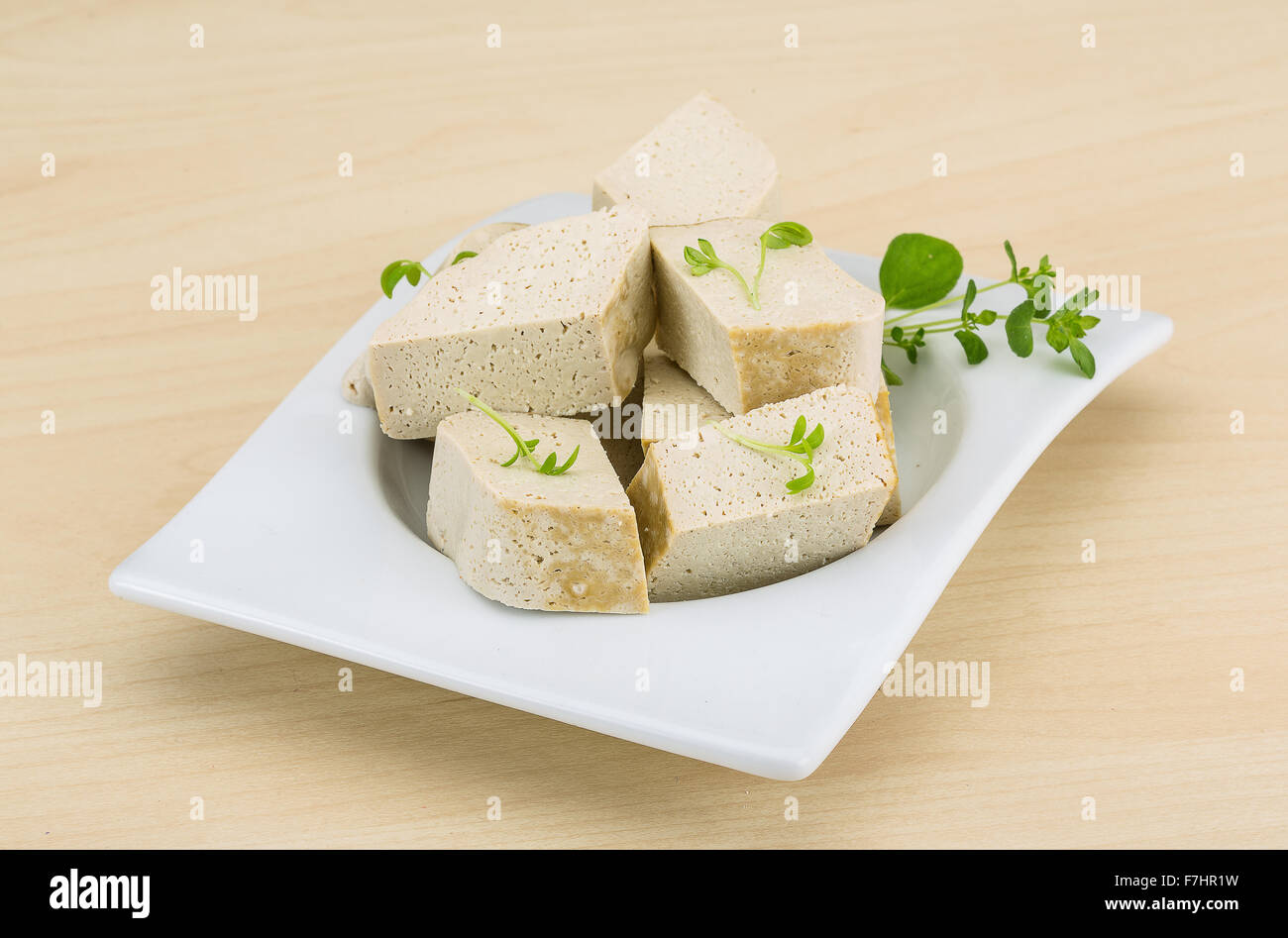Tofu - soya cheese with herbs on the wood background Stock Photo - Alamy