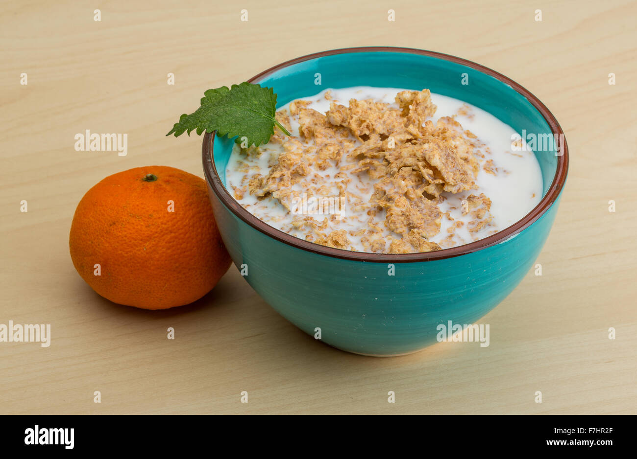 Cornflakes with tangerine and fresh mint leaves Stock Photo - Alamy