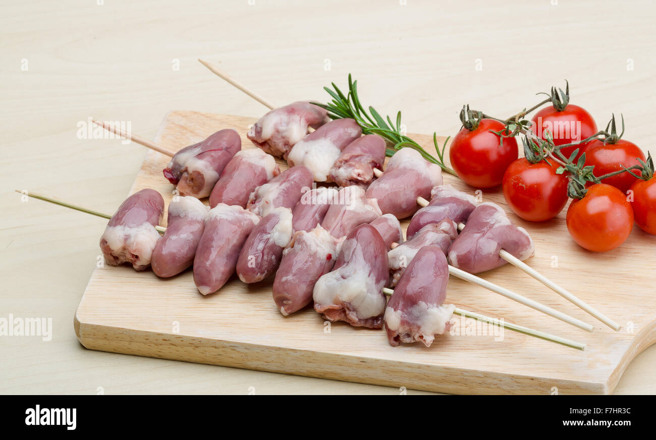 Raw chicken hearts ready for barbecue with rosemary Stock Photo - Alamy