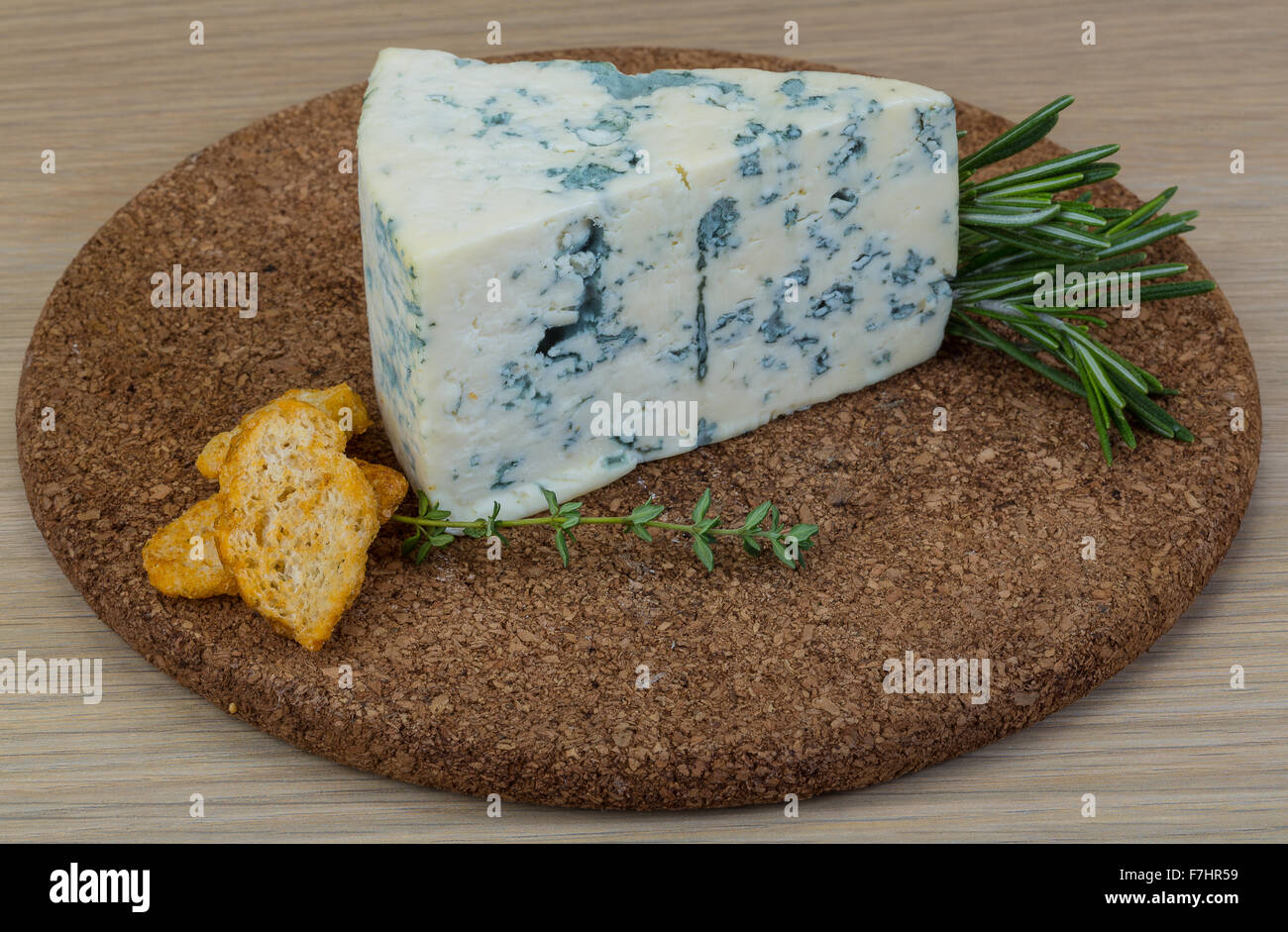 Blue cheese with mold on the wood background Stock Photo - Alamy