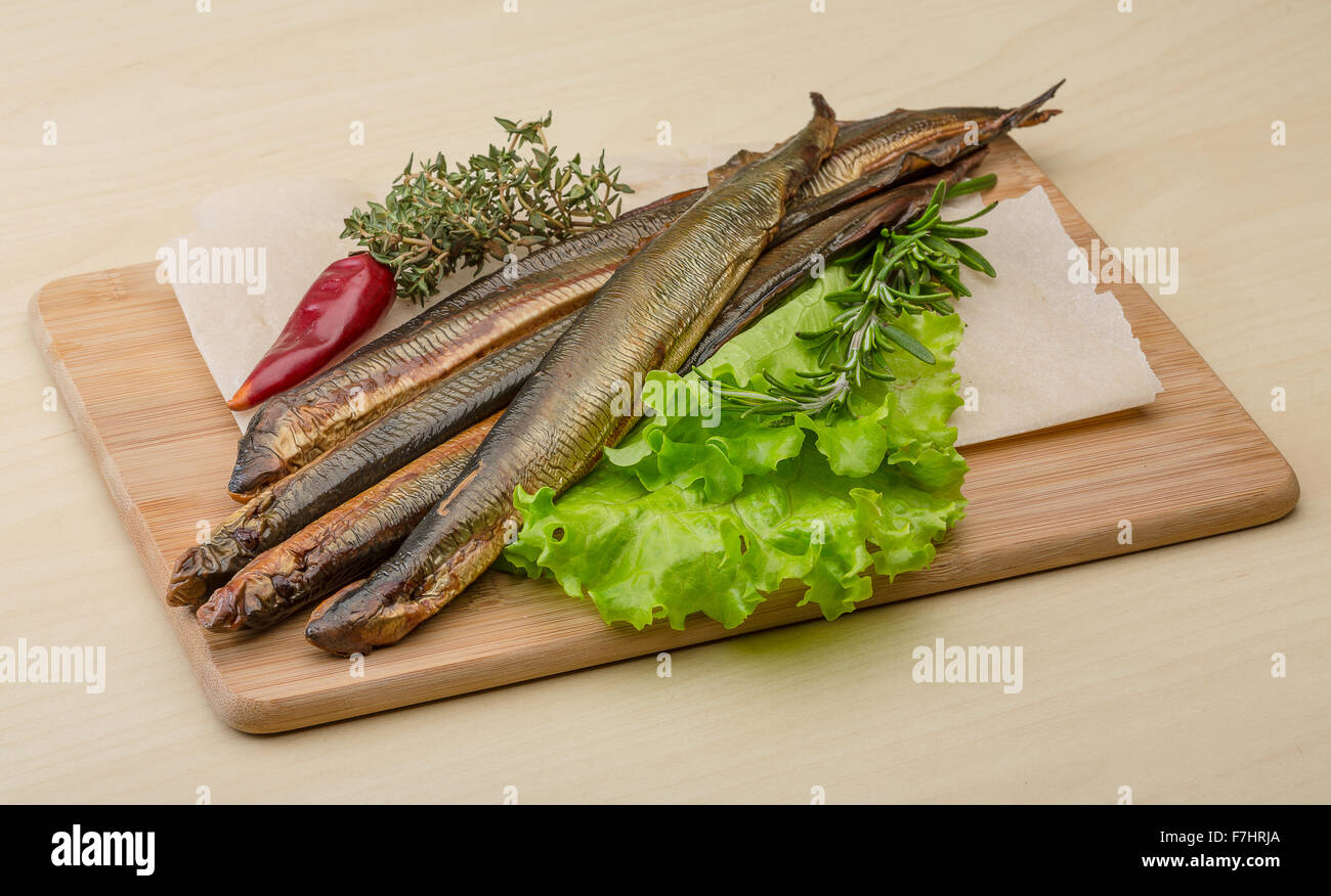 Smoked Lamprey - seafood delicacy with salad and herbs Stock Photo - Alamy