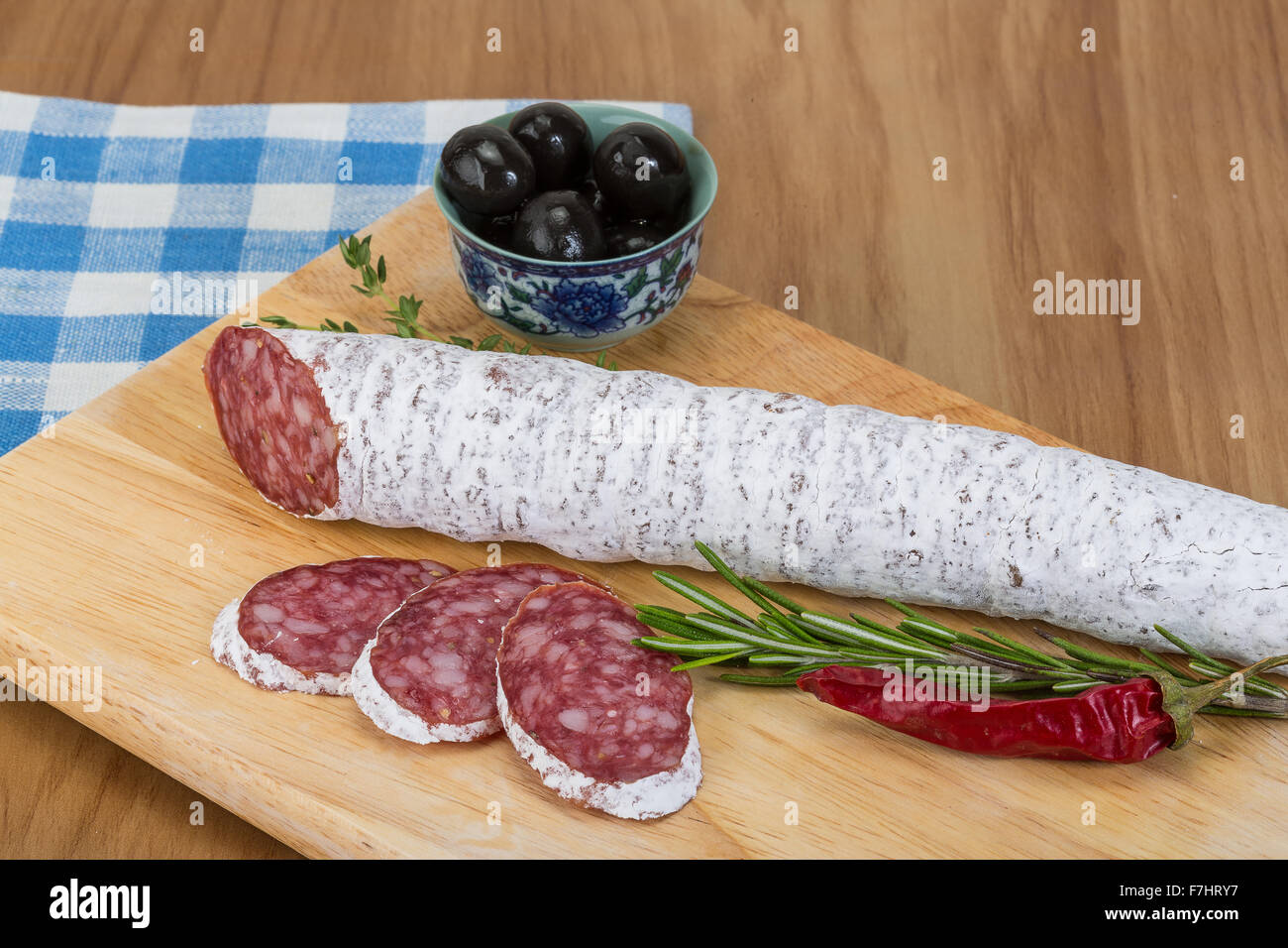 Fuet sausage - Spanish meat sliced with herbs Stock Photo - Alamy