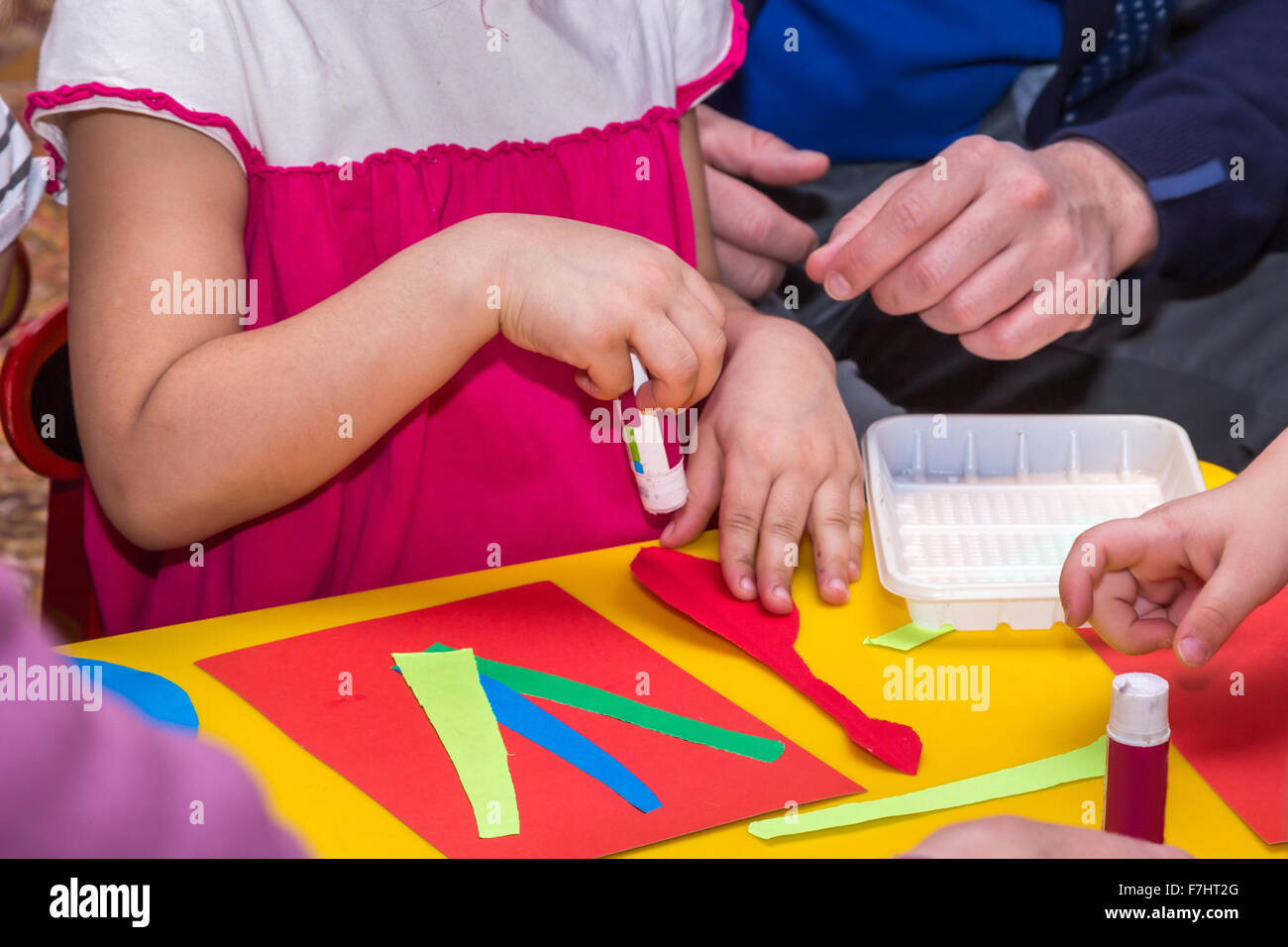 Children with adults hi-res stock photography and images - Alamy
