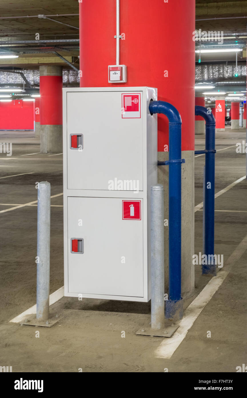 Fire extinguisher and fire hose in the mall parking lot Stock Photo - Alamy