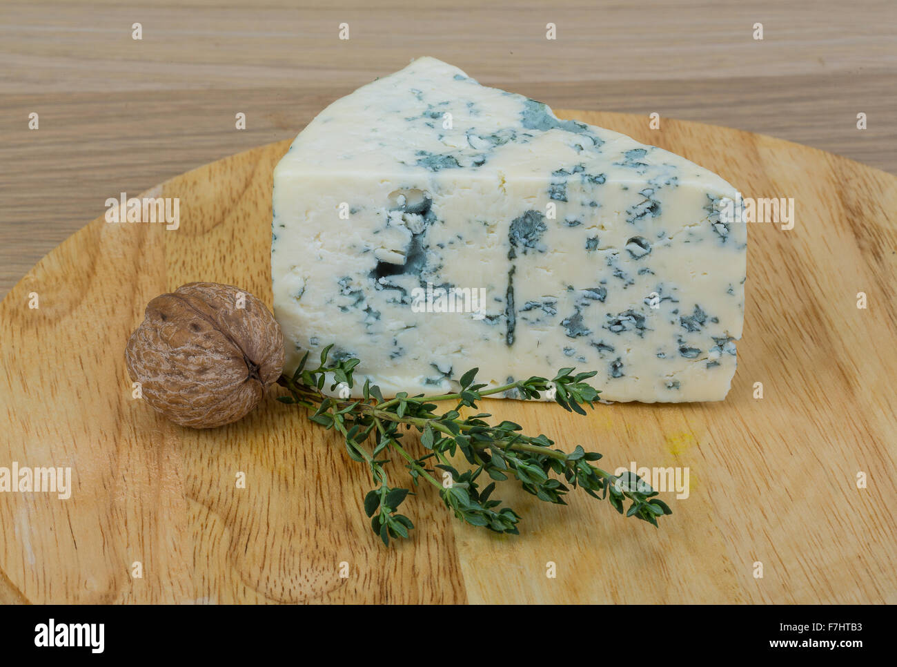 Blue cheese with mold on the wood background Stock Photo - Alamy