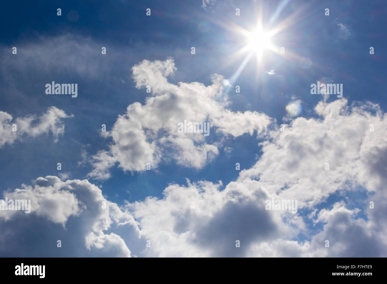Sky clouds and sun on bright summer day Stock Photo - Alamy