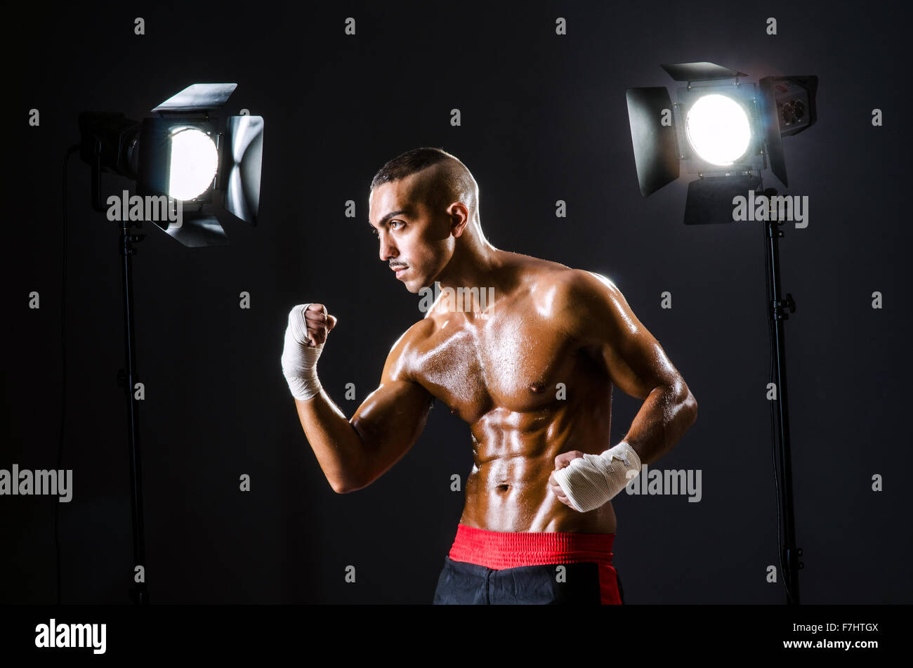 Boxer with studio lights in sports concept Stock Photo - Alamy