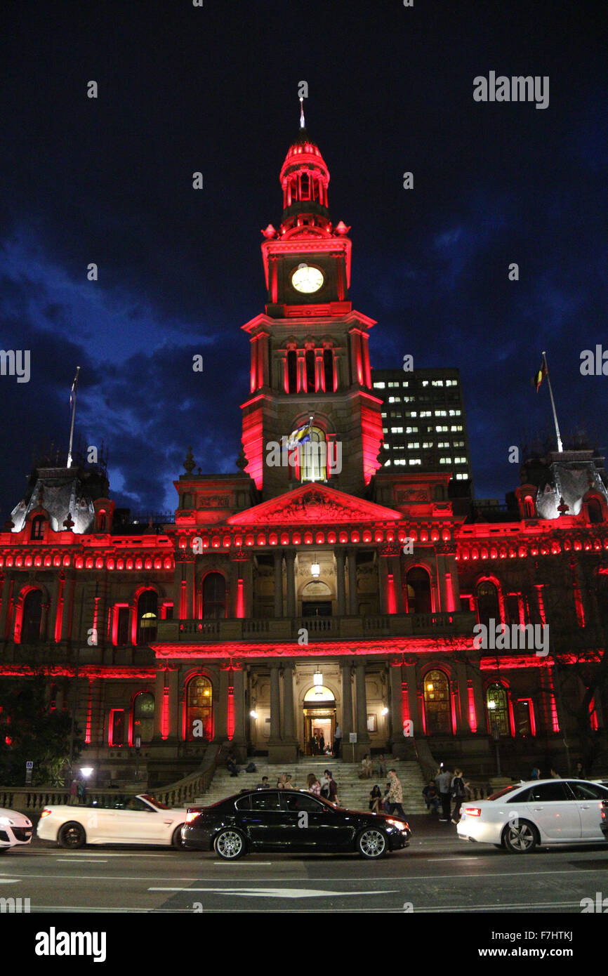 Sydney, Australia. 1 December 2015. Sydney Town Hall is lit up red on ...