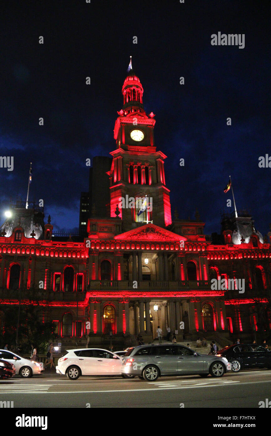 Sydney, Australia. 1 December 2015. Sydney Town Hall is lit up red on ...