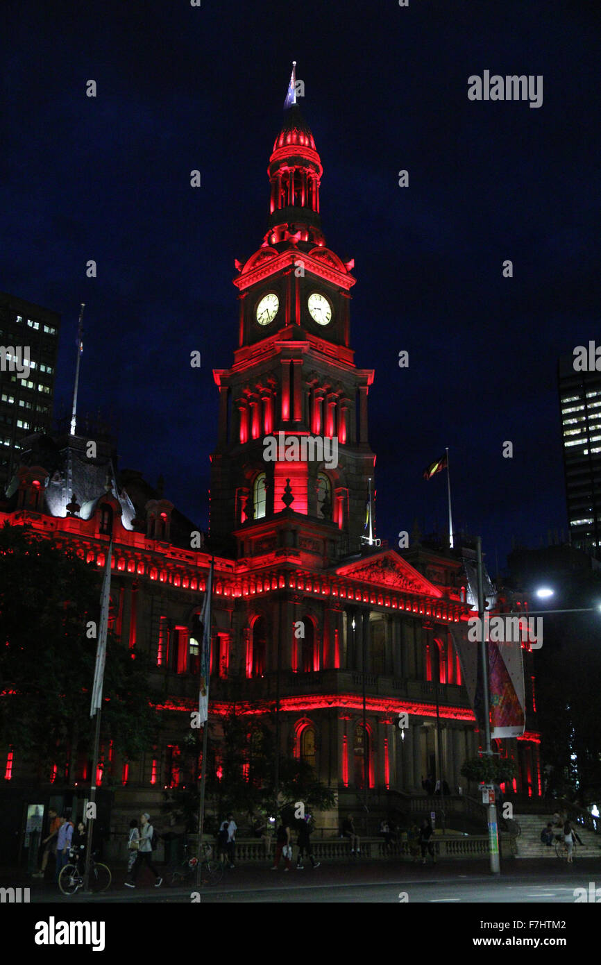Sydney, Australia. 1 December 2015. Sydney Town Hall is lit up red on ...