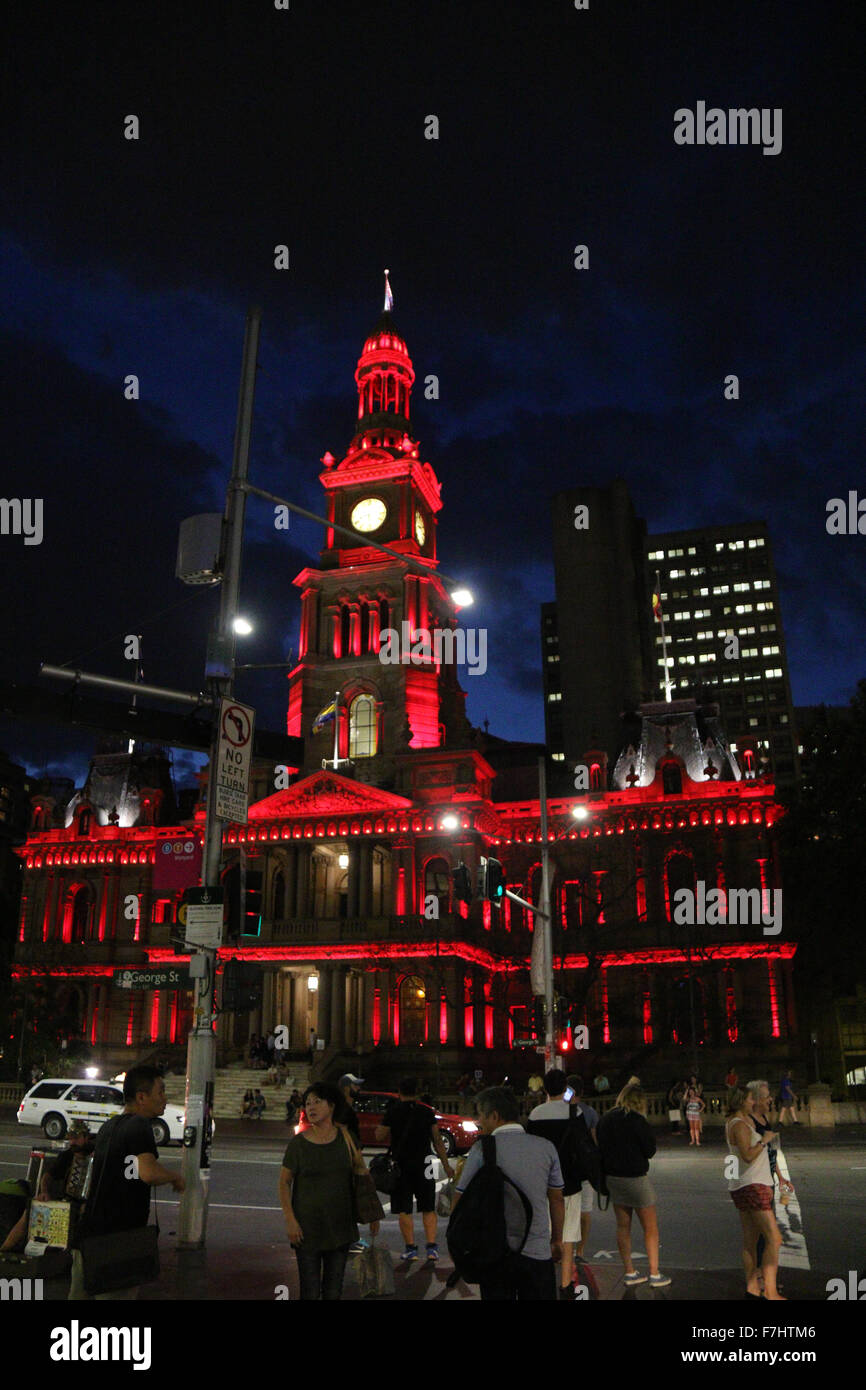 Sydney, Australia. 1 December 2015. Sydney Town Hall is lit up red on ...