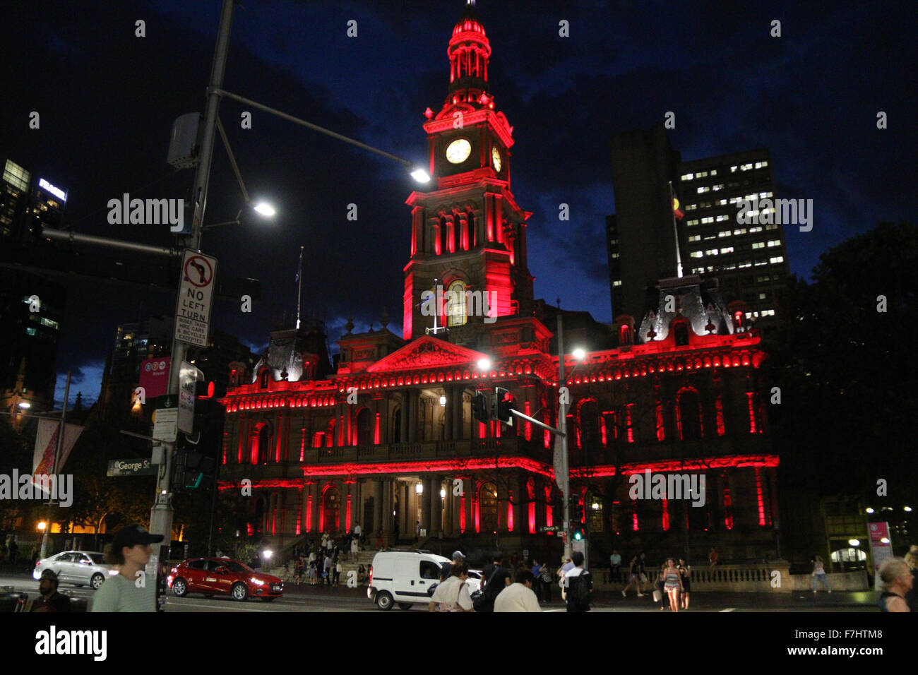 Sydney, Australia. 1 December 2015. Sydney Town Hall is lit up red on ...
