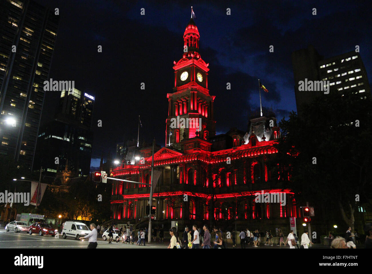 Sydney, Australia. 1 December 2015. Sydney Town Hall is lit up red on ...