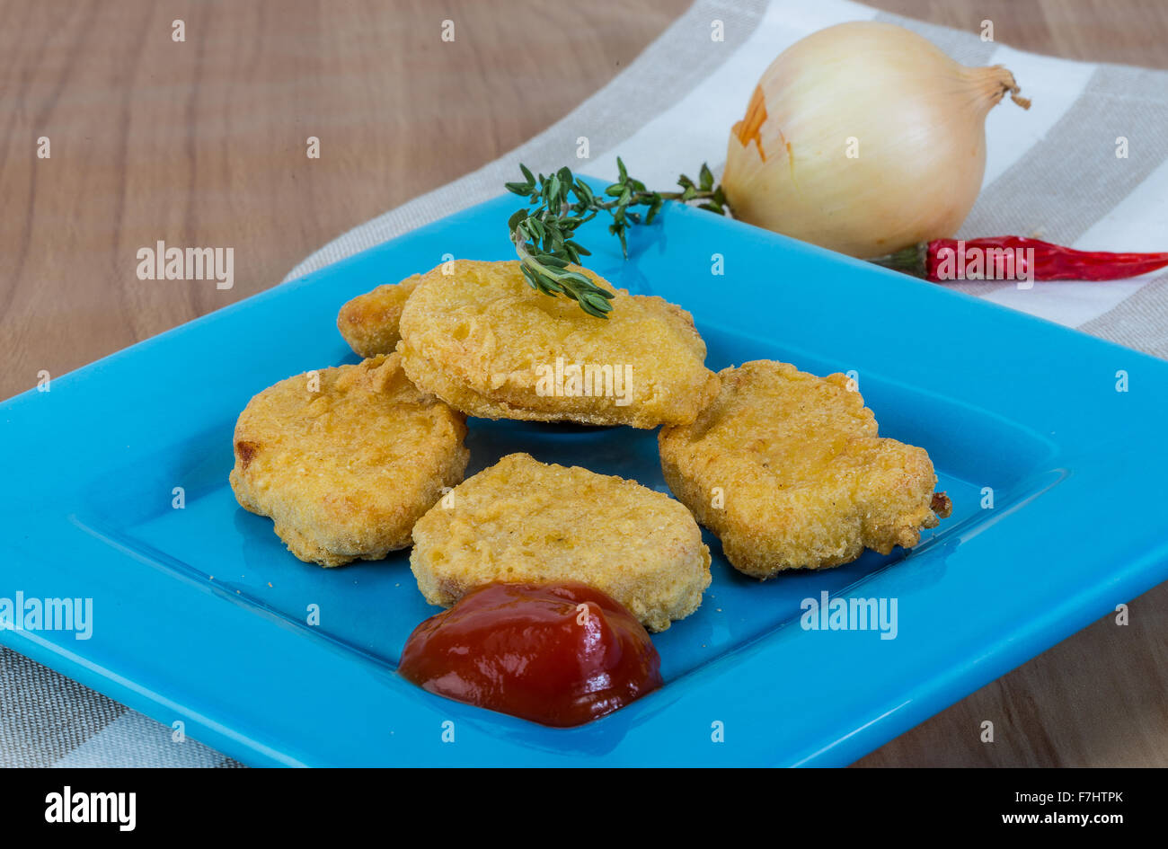 Chicken nuggets in blue hi-res stock photography and images - Alamy