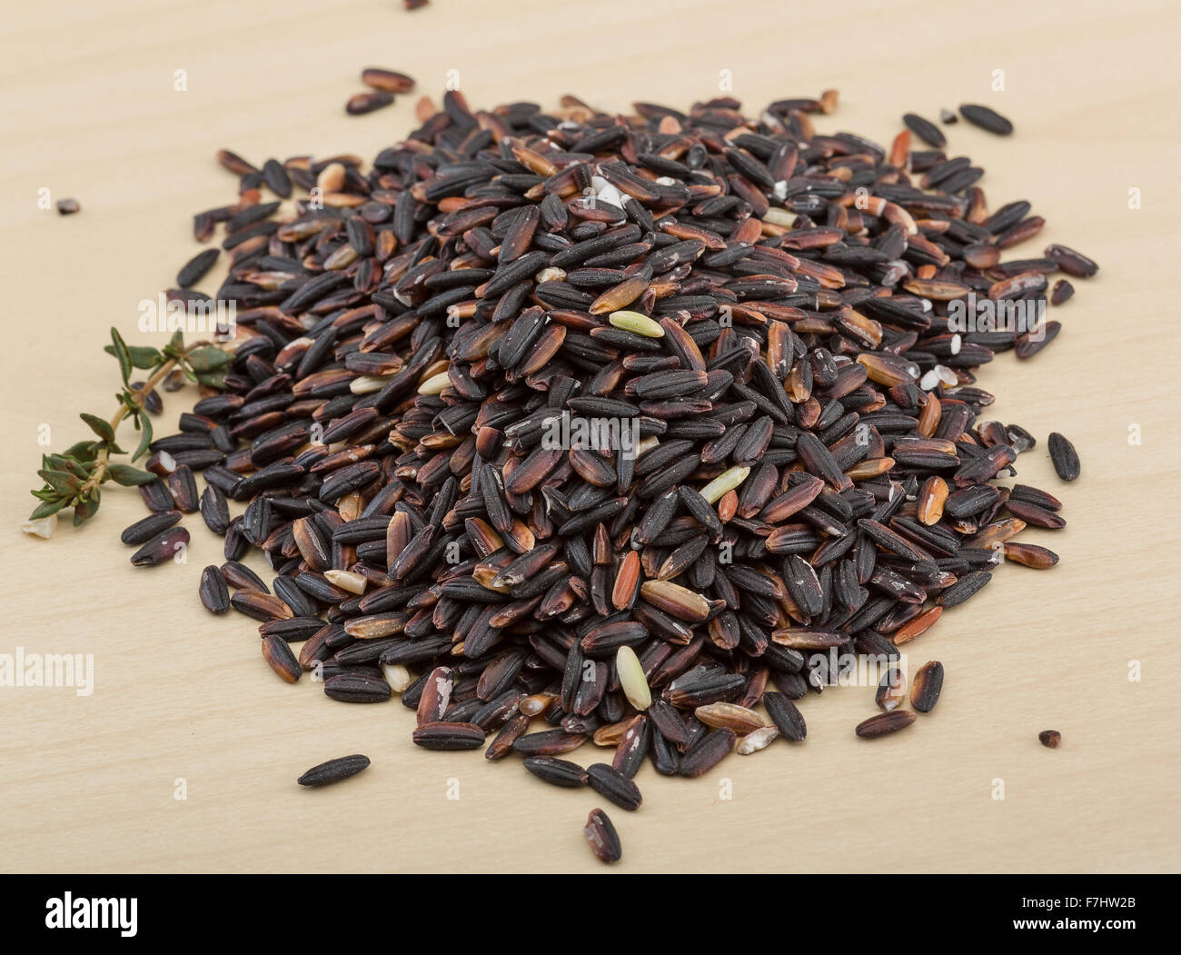 Dry wild rice mix heap on the wood background Stock Photo - Alamy