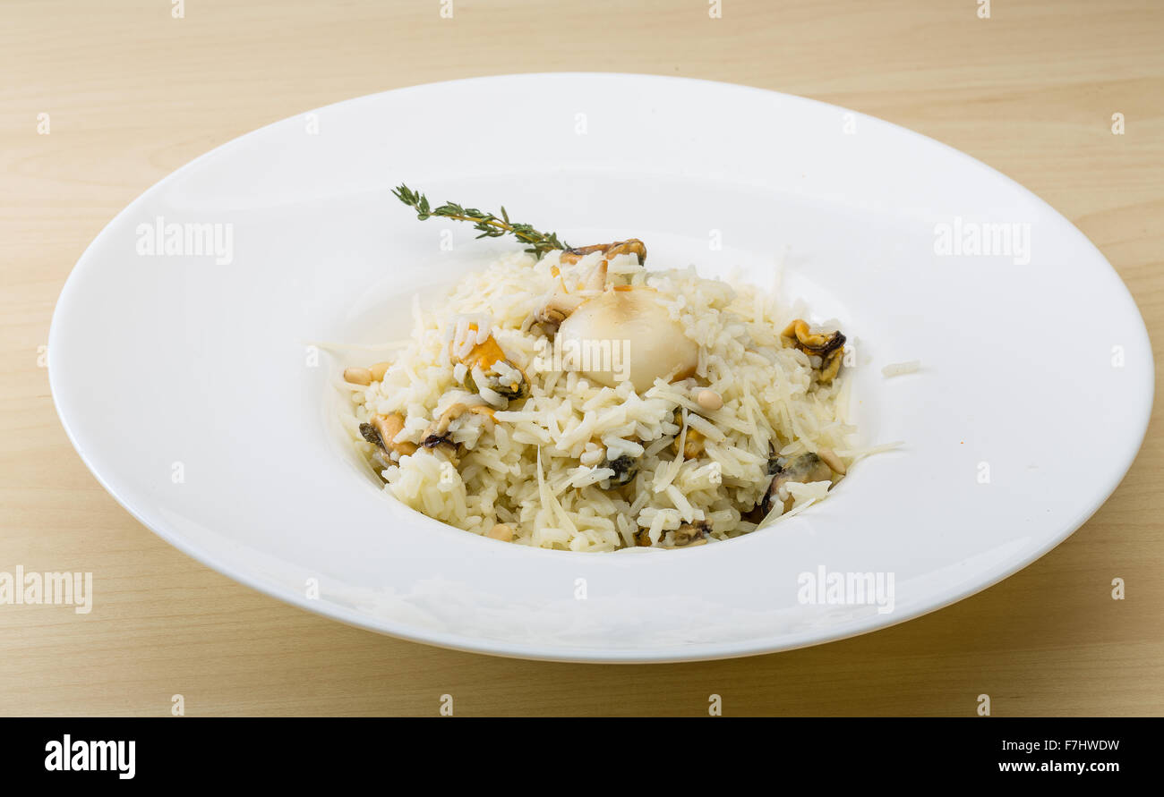 Risotto with mussels and cuttlefish served fresh thyme Stock Photo - Alamy