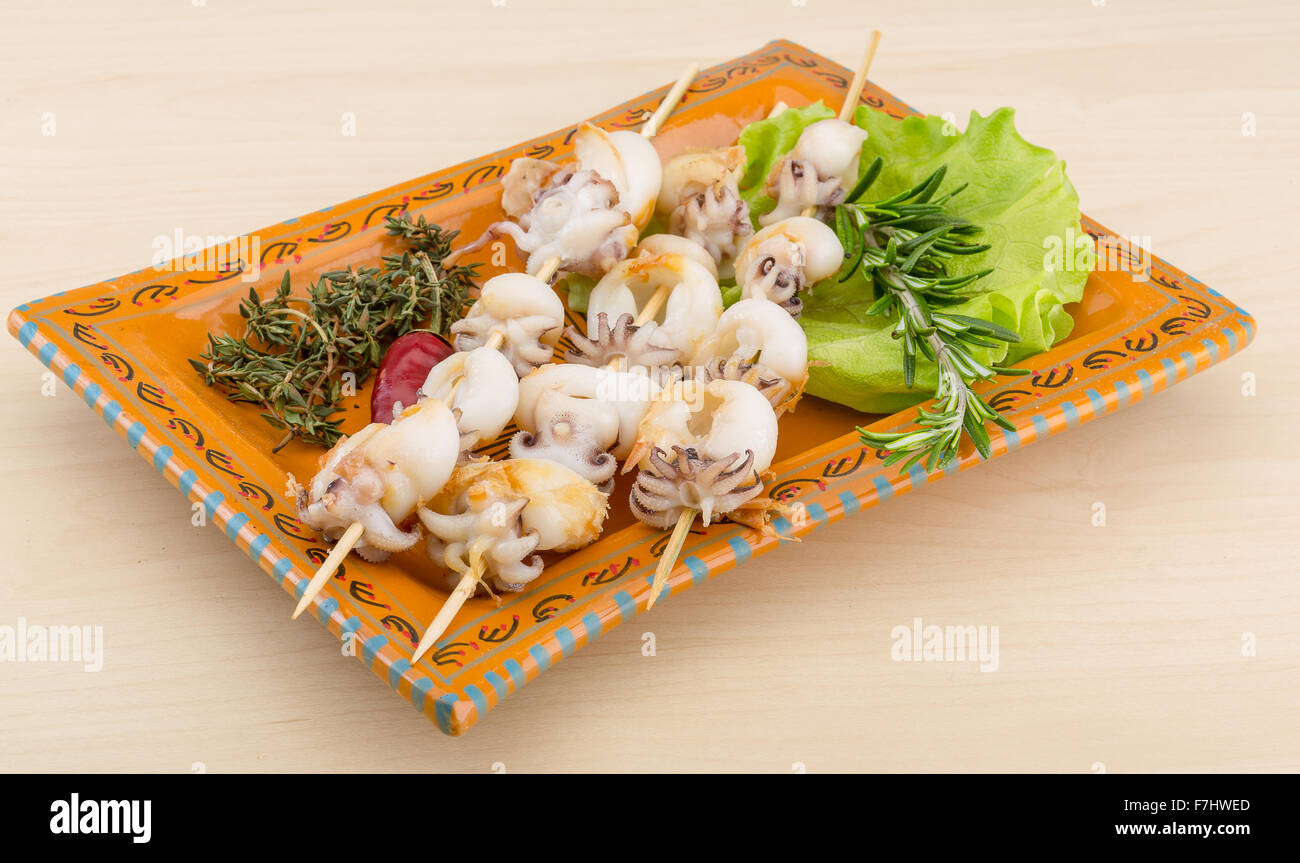 Grilled cuttlefish bbq with rosemary and pepper Stock Photo - Alamy