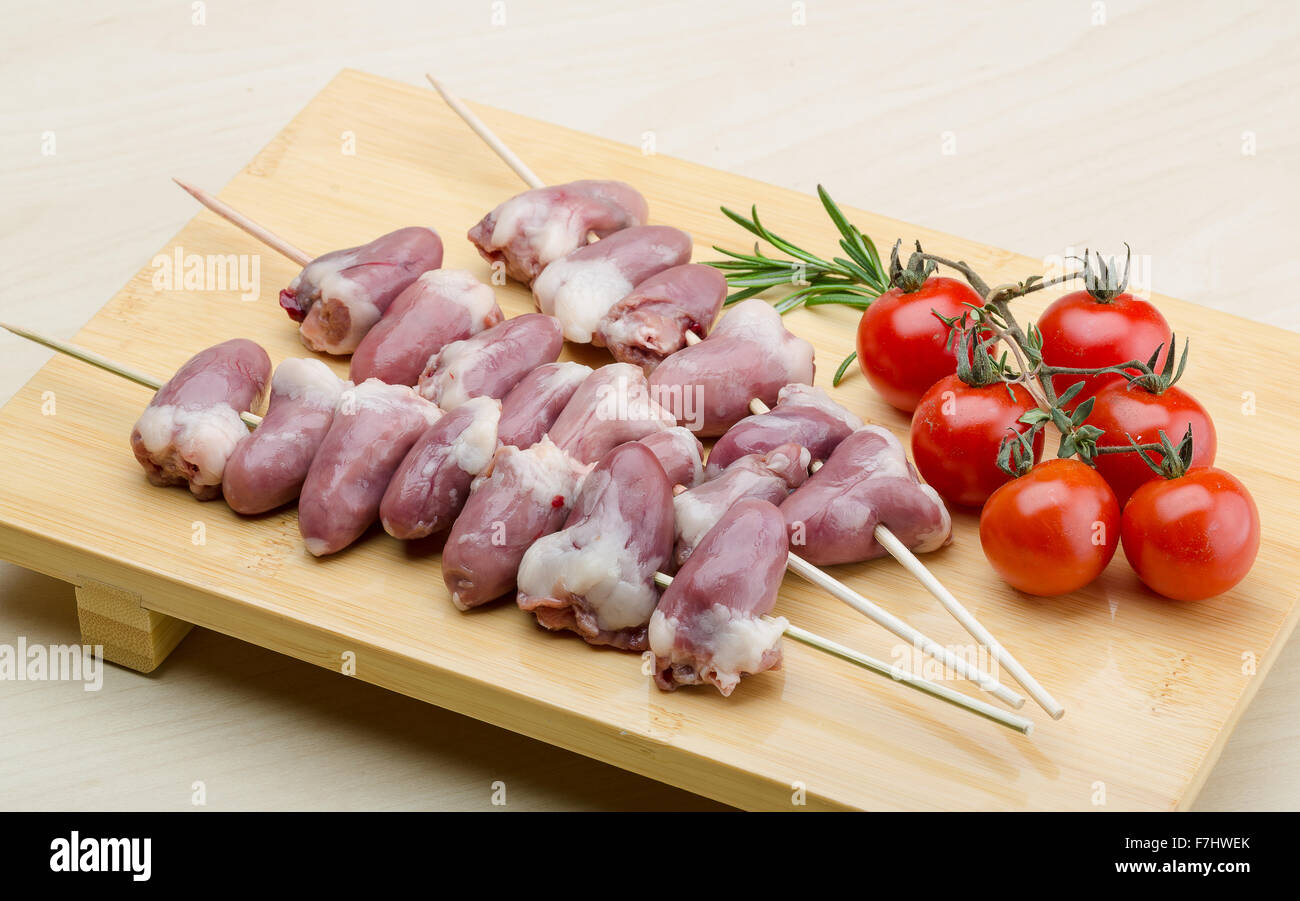Raw chicken hearts ready for barbecue with rosemary Stock Photo - Alamy