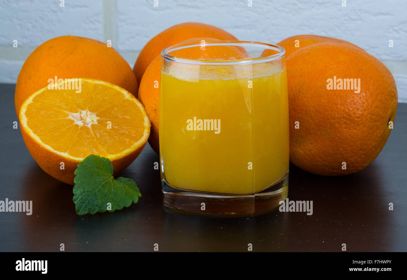 Fresh made Orange juice with ripe fruits Stock Photo - Alamy