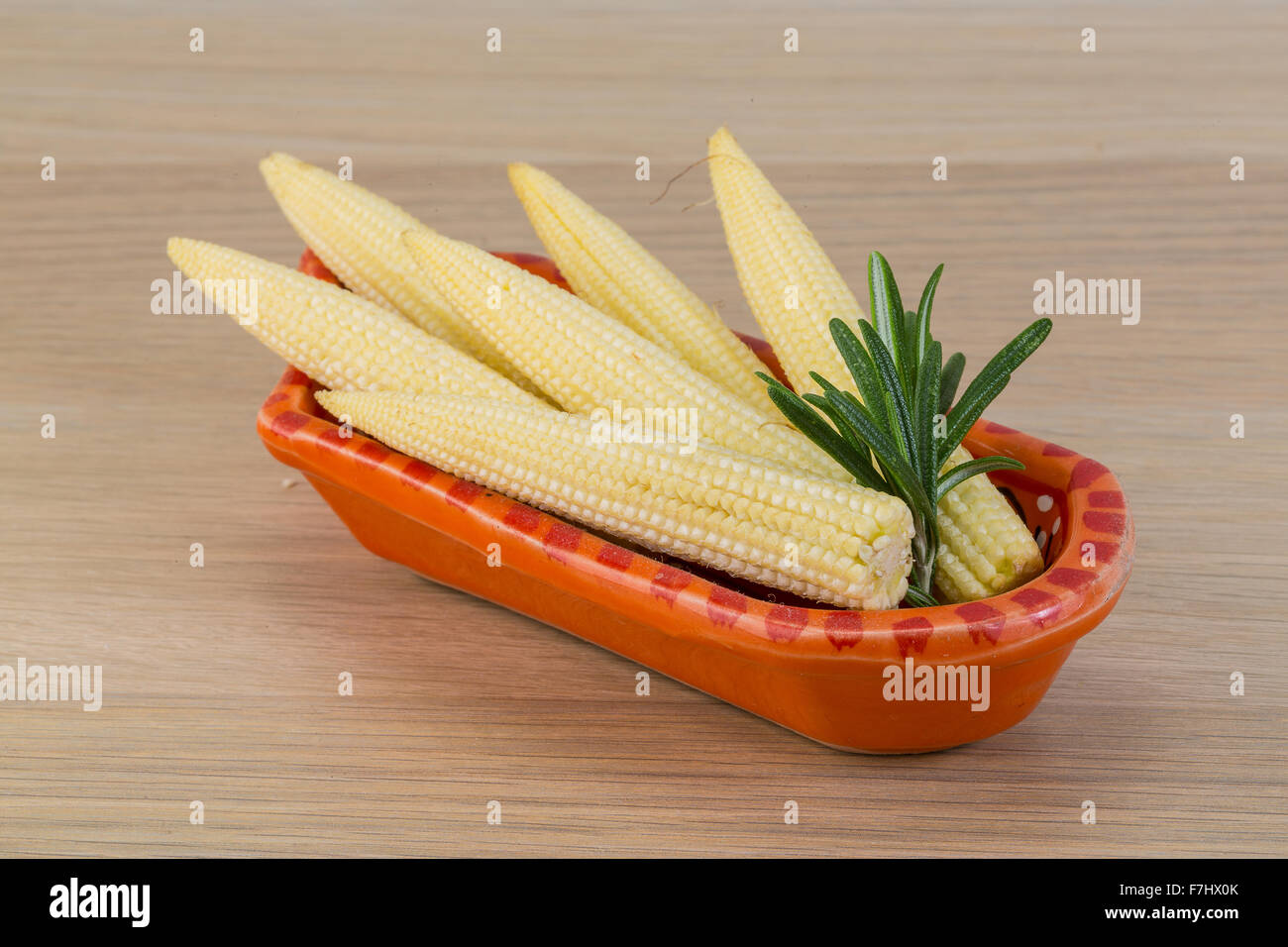 Fresh ripe Baby corn on the wood background Stock Photo - Alamy