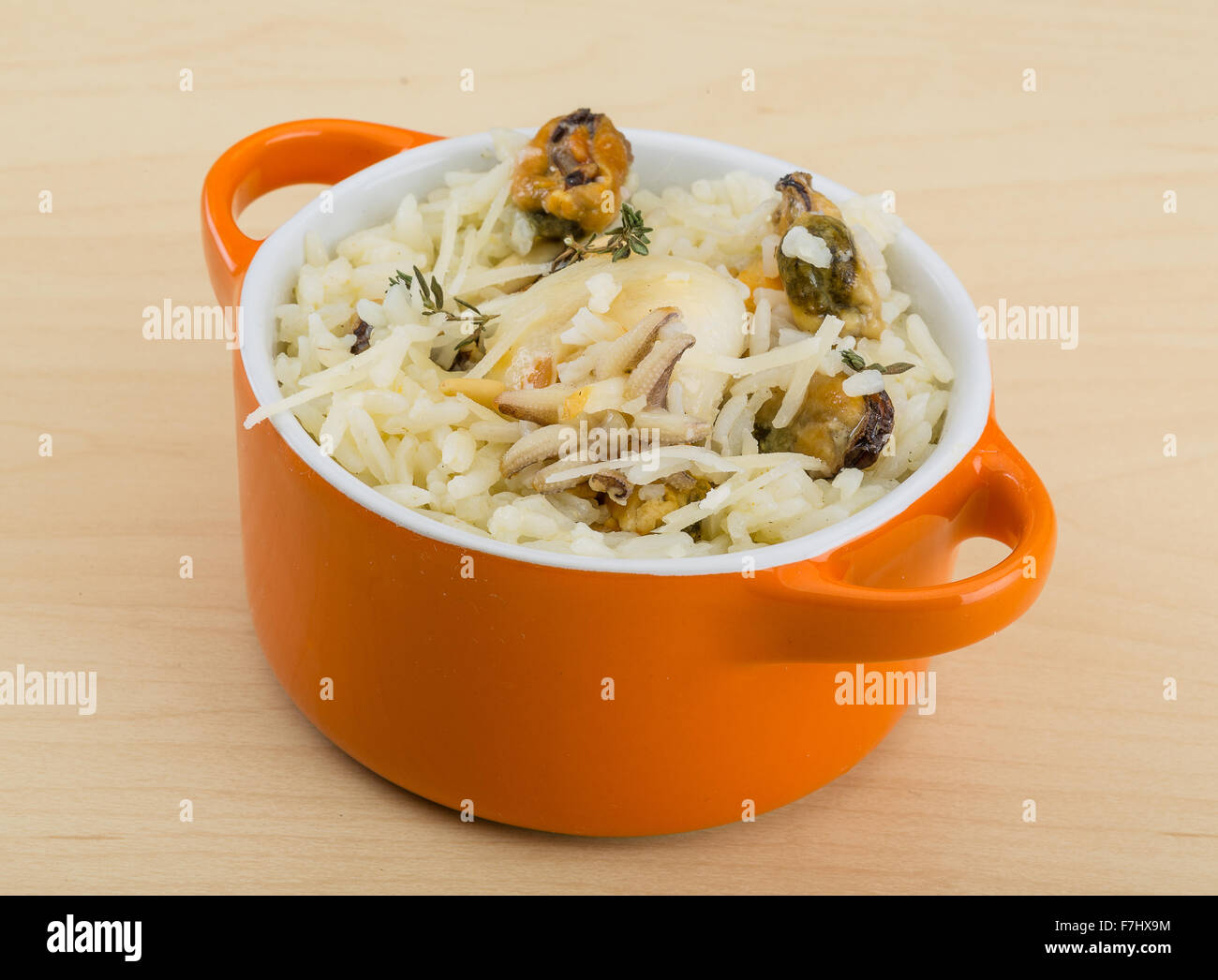 Risotto with mussels and cuttlefish served fresh thyme Stock Photo - Alamy