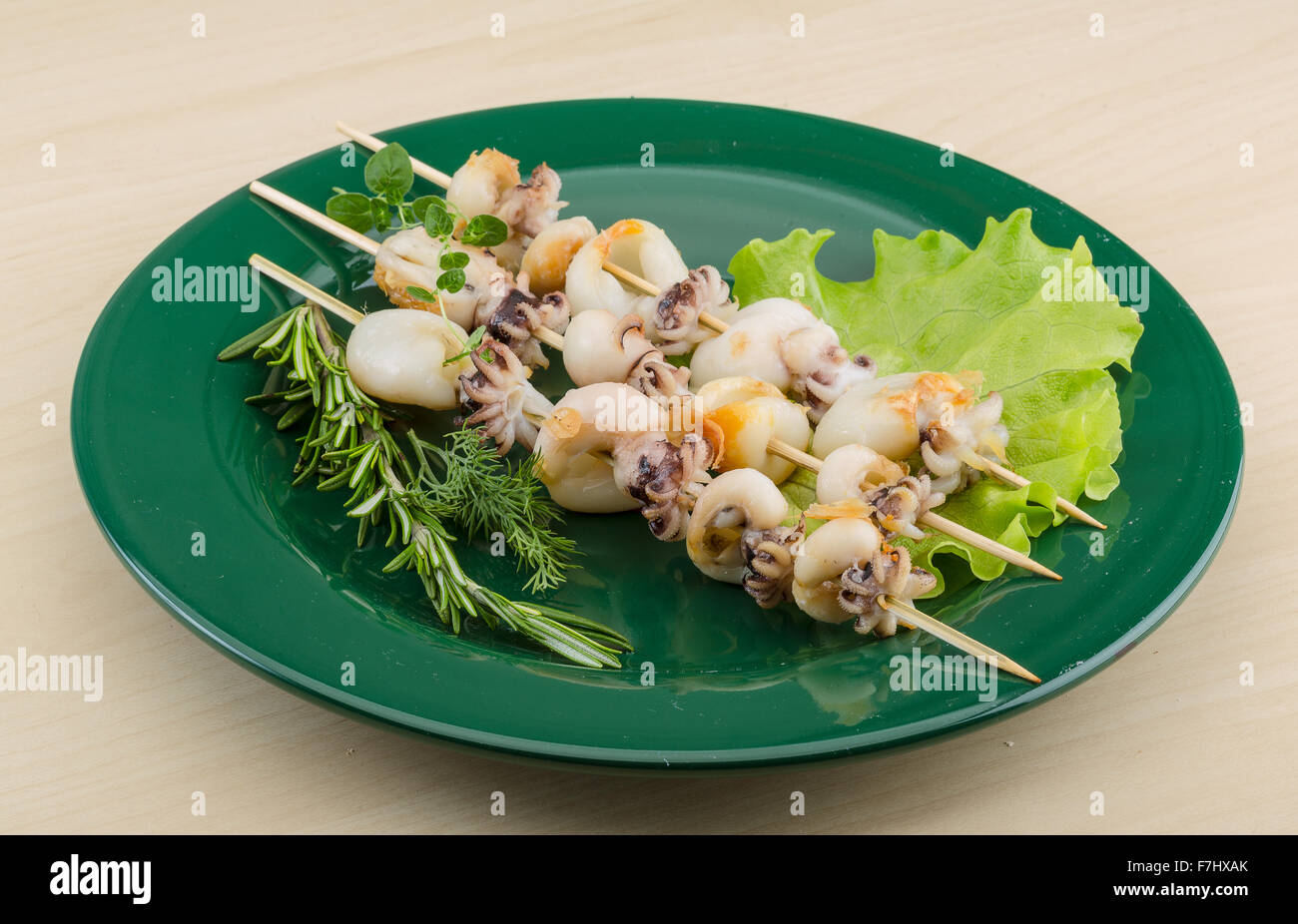 Grilled cuttlefish bbq with rosemary and pepper Stock Photo - Alamy