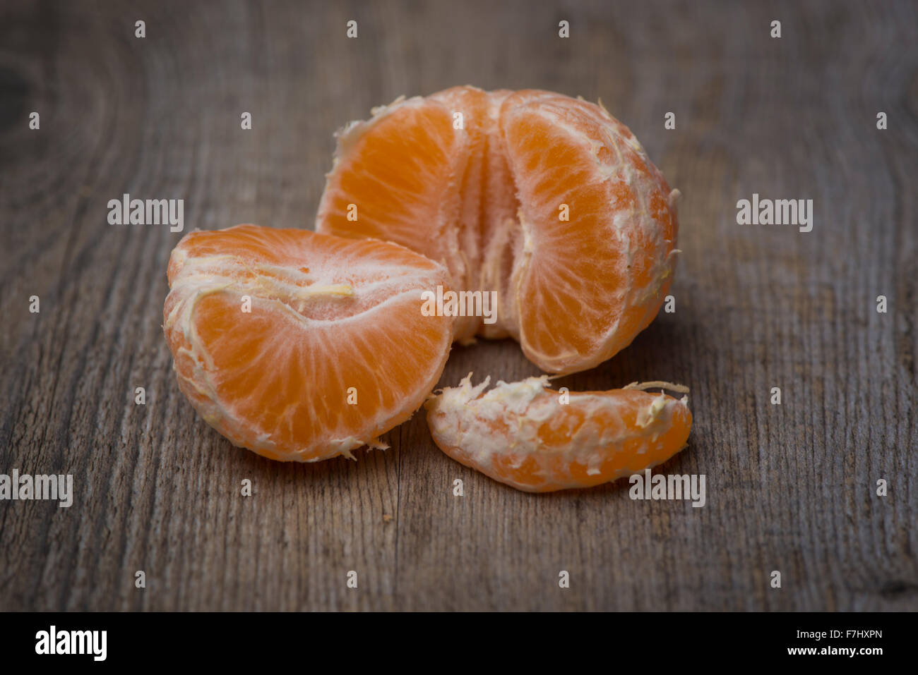 Peeled clementine slices, orange fruit Stock Photo - Alamy