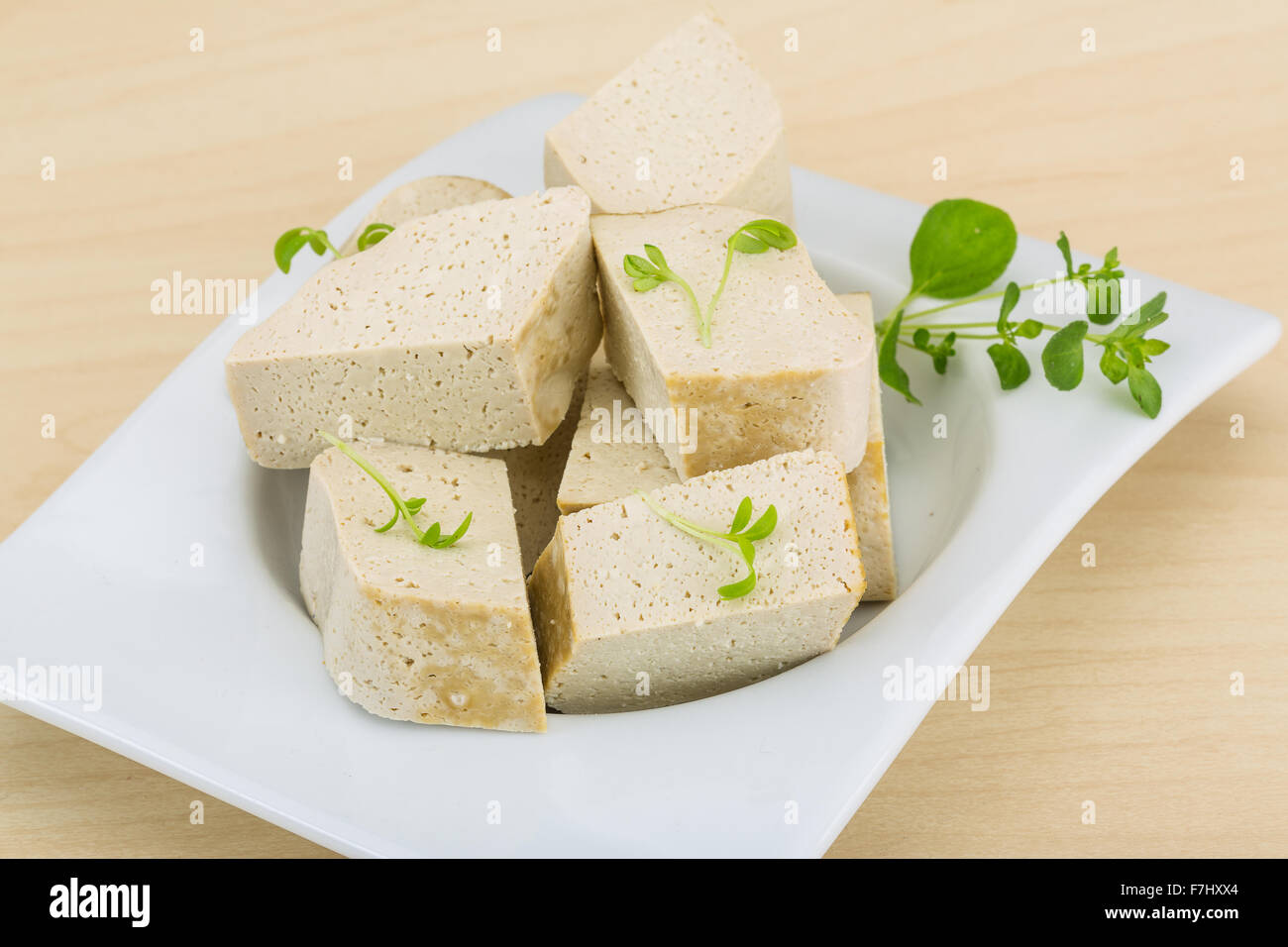 Tofu - soya cheese with herbs on the wood background Stock Photo - Alamy