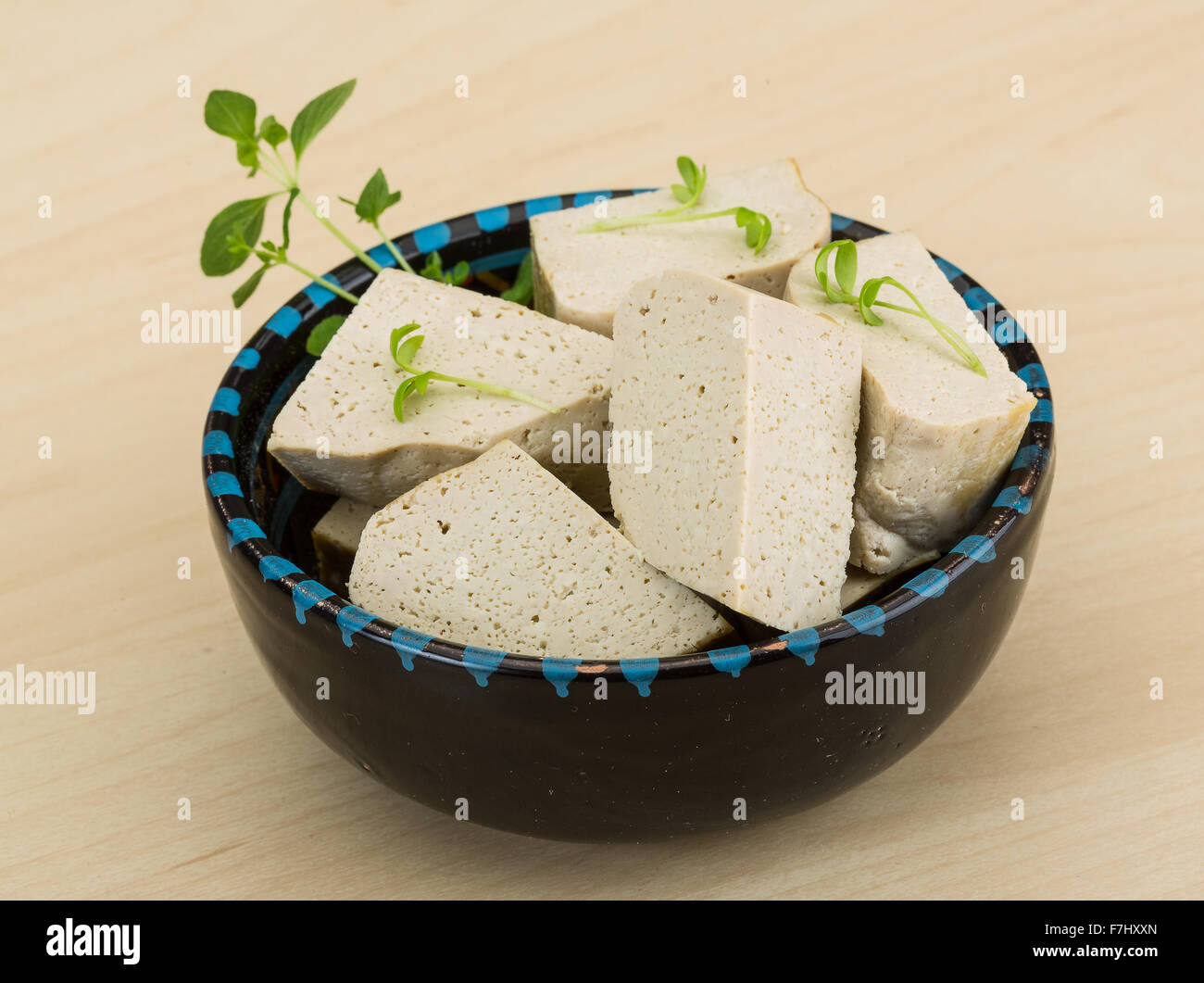 Tofu - soya cheese with herbs on the wood background Stock Photo - Alamy