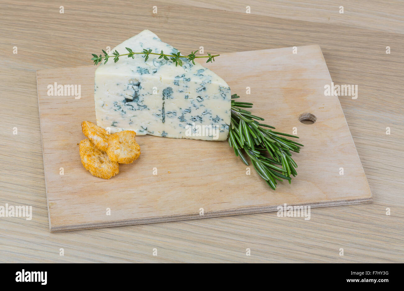 Blue cheese with mold on the wood background Stock Photo - Alamy