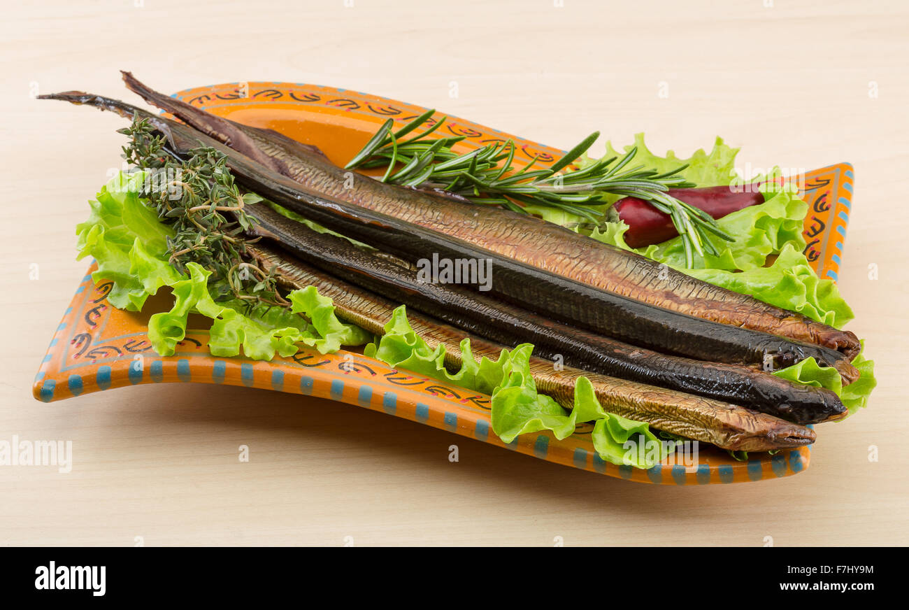 Smoked Lamprey - seafood delicacy with salad and herbs Stock Photo - Alamy