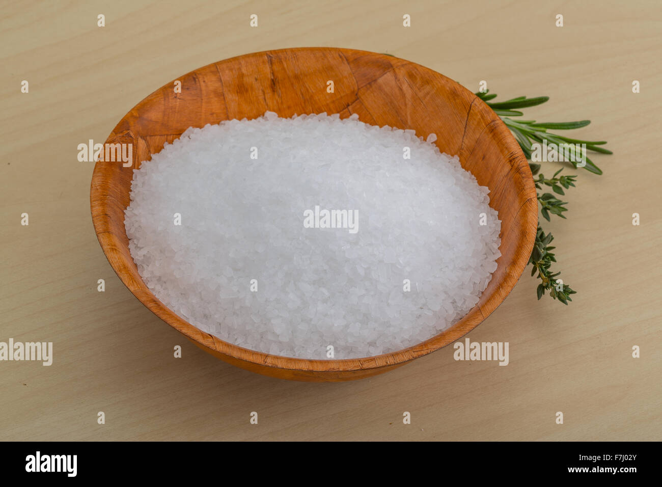 Sea salt heap crystal with thyme branch Stock Photo - Alamy