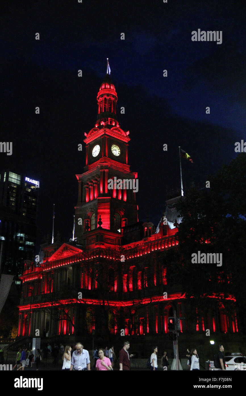 Sydney, Australia. 1 December 2015. Sydney Town Hall is lit up red on ...