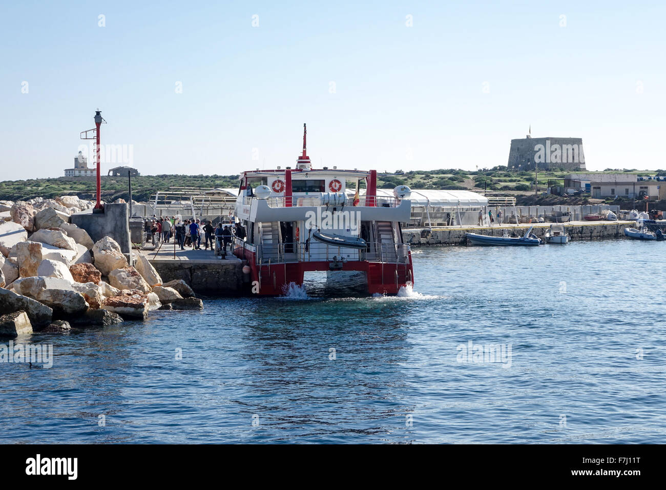 Tabarca Island, boats in the small harbour, passenger ferry loading ...