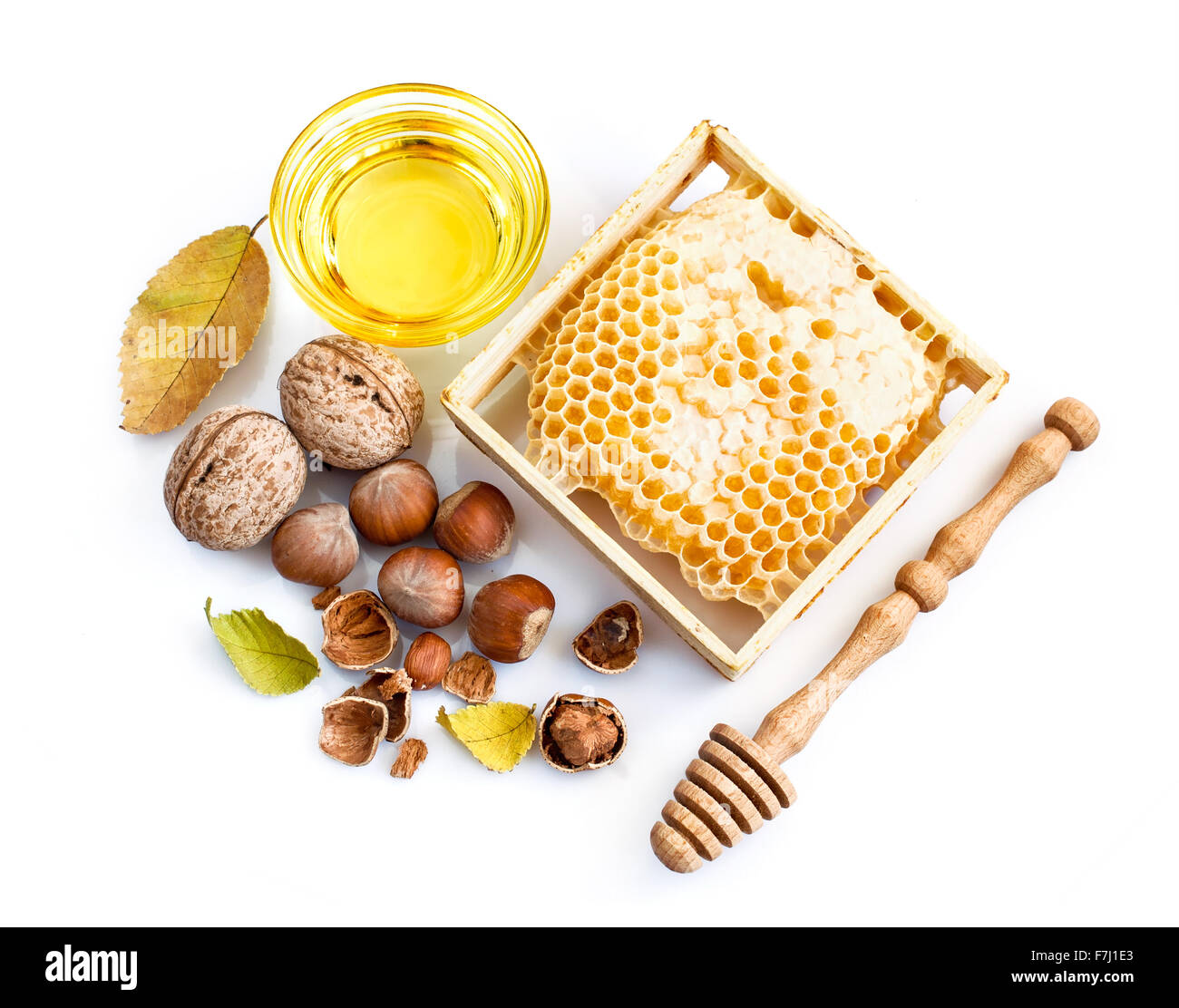 Honeycomb and nuts isolated over white Stock Photo - Alamy