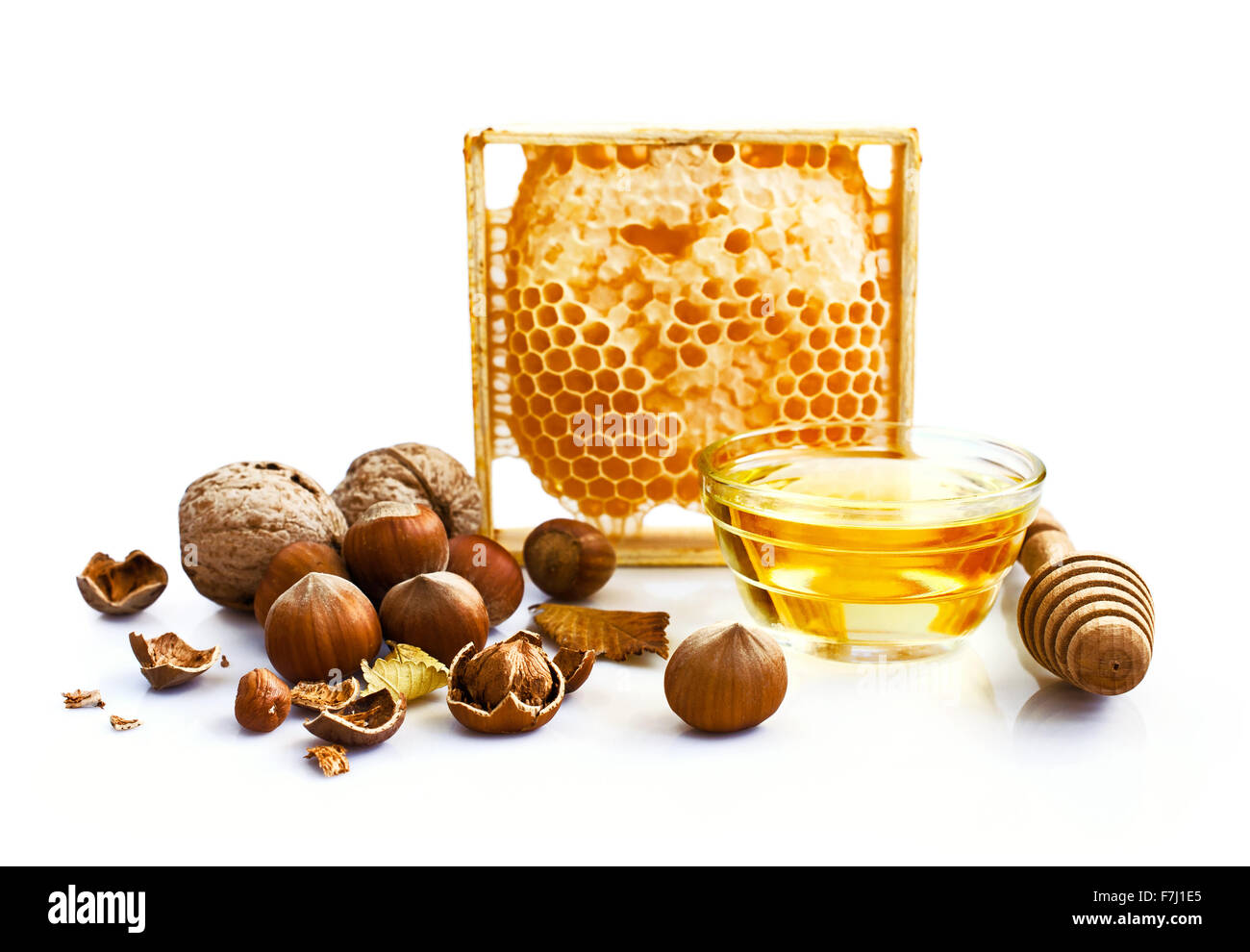 Honeycomb and nuts isolated over white Stock Photo - Alamy