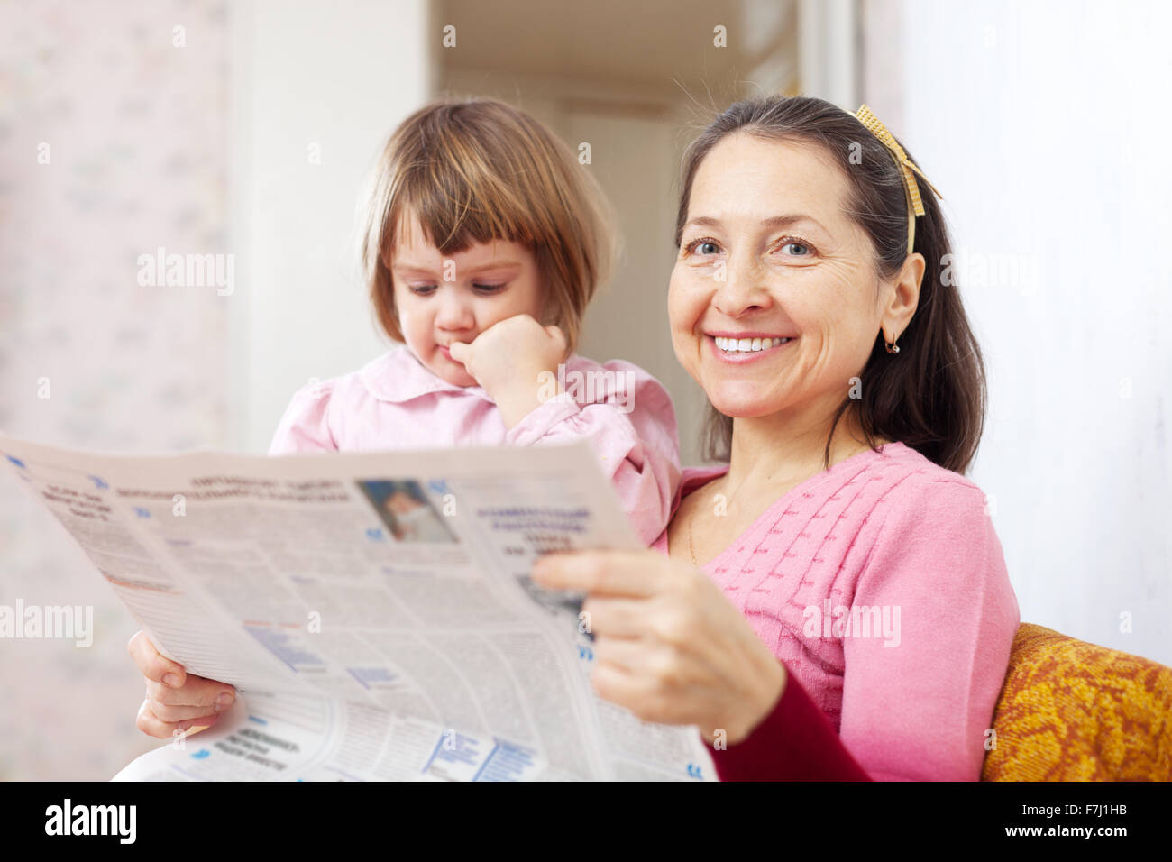 Child reading newspaper article hi-res stock photography and images - Alamy