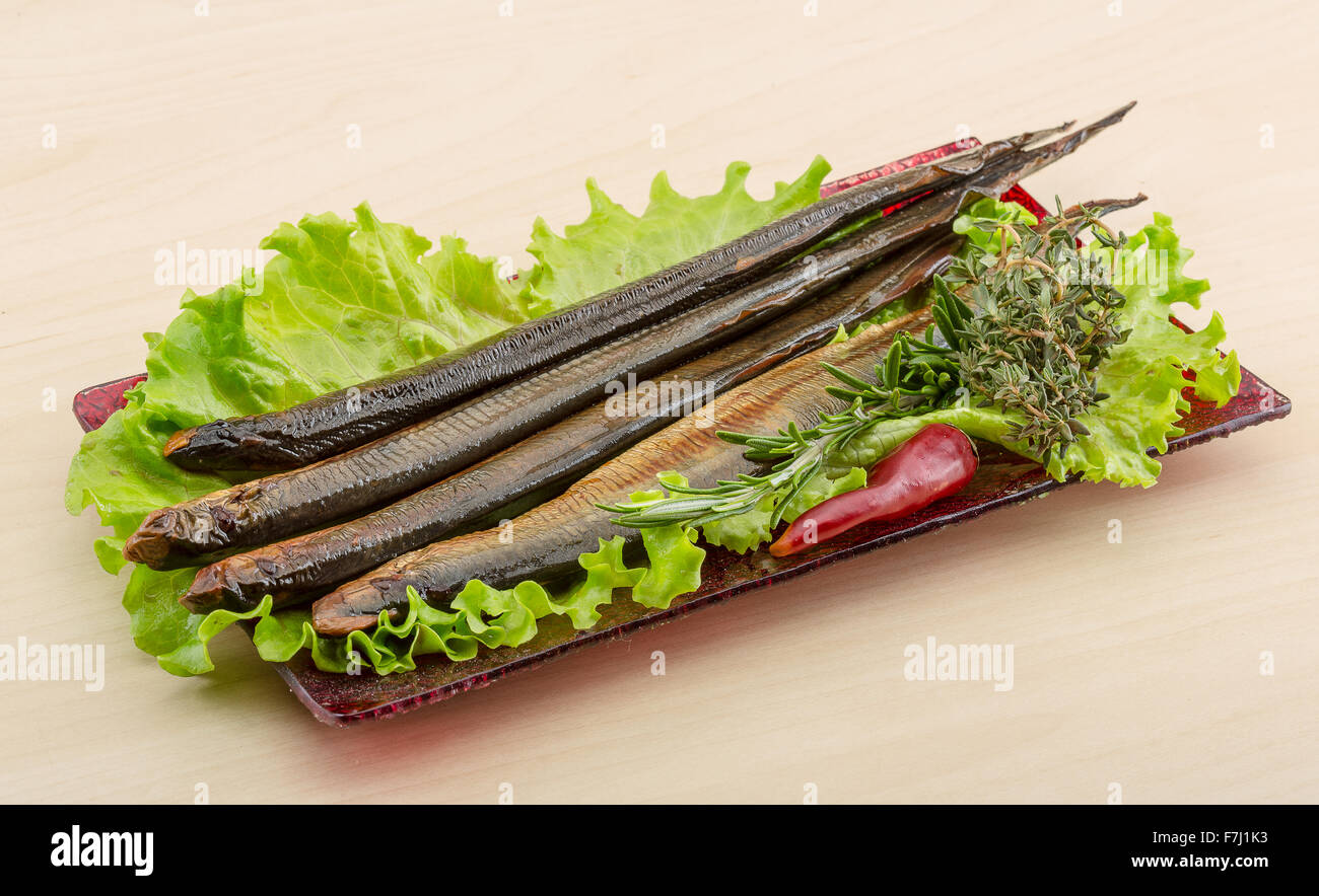 Smoked Lamprey - seafood delicacy with salad and herbs Stock Photo - Alamy