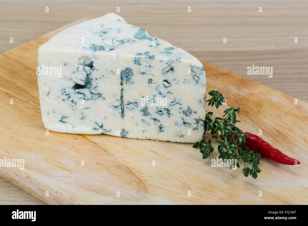 Blue cheese with mold on the wood background Stock Photo - Alamy