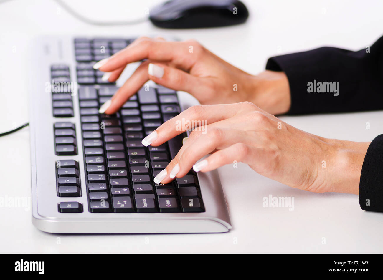 Hands working on the keyboard Stock Photo - Alamy