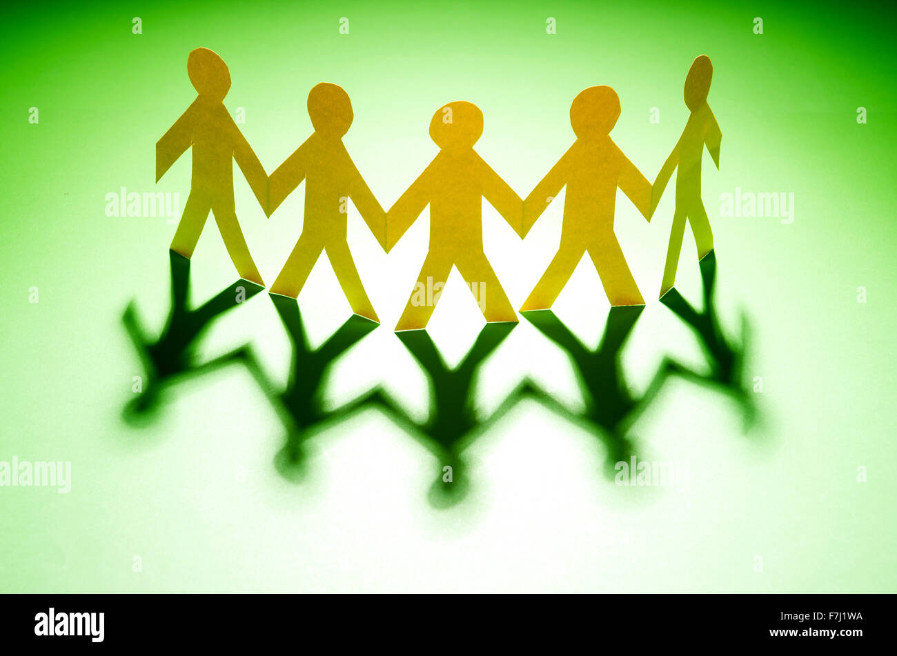 Paper people in teamworking concept Stock Photo - Alamy