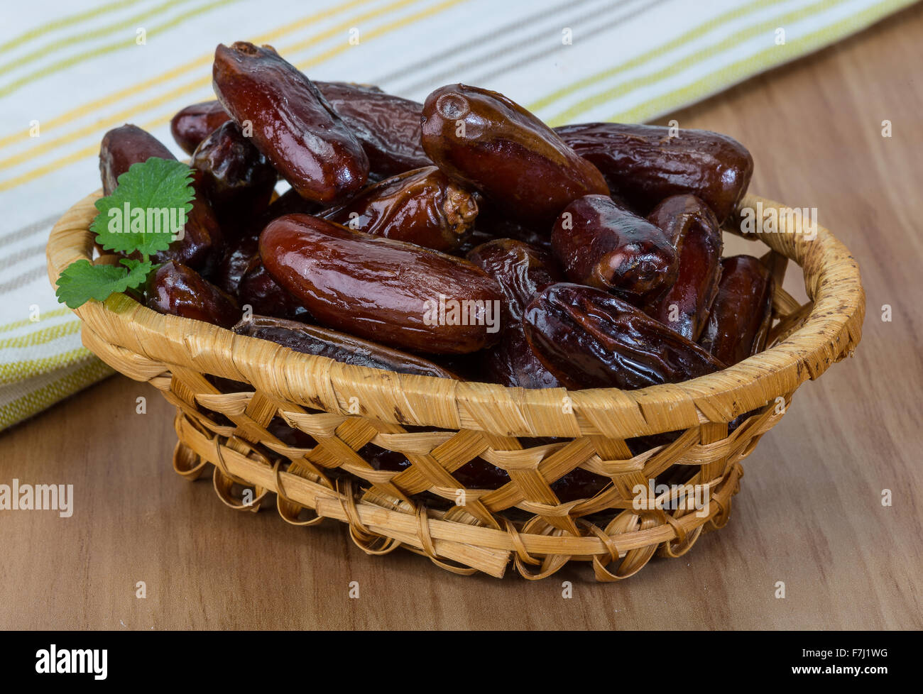 Dry Dates fruit in the bowl on the wood background Stock Photo - Alamy