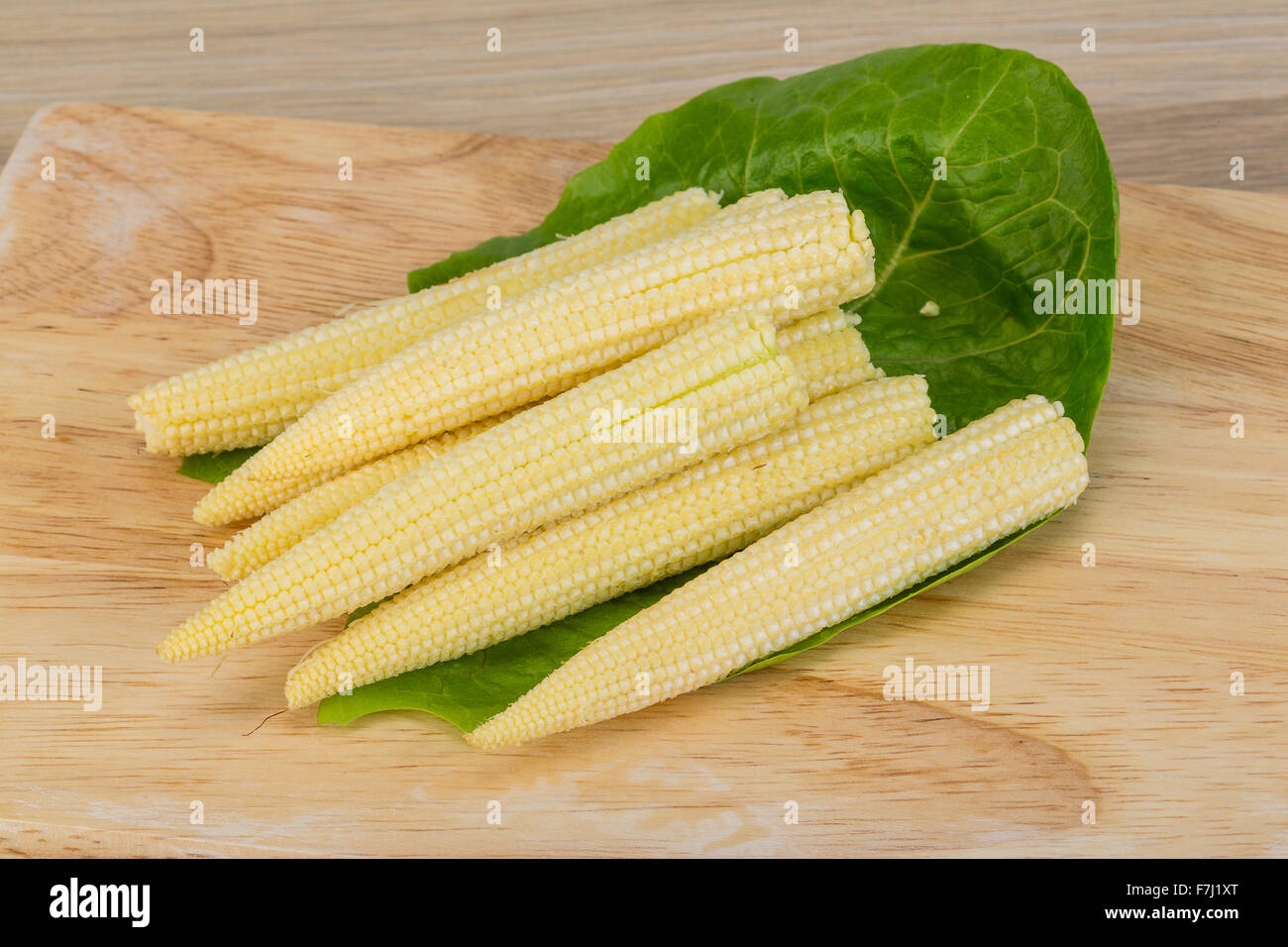 Fresh ripe Baby corn on the wood background Stock Photo - Alamy