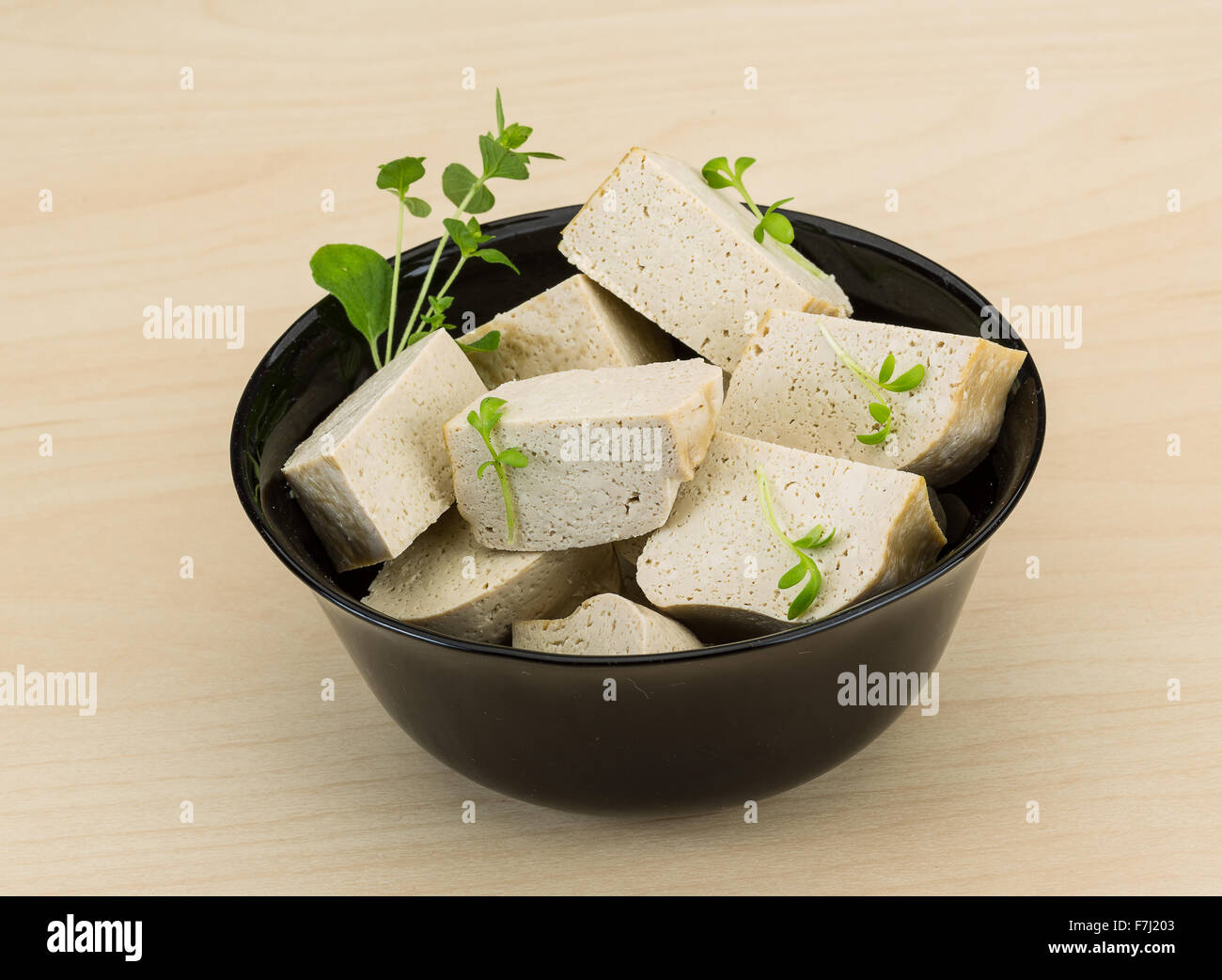 Tofu - soya cheese with herbs on the wood background Stock Photo - Alamy