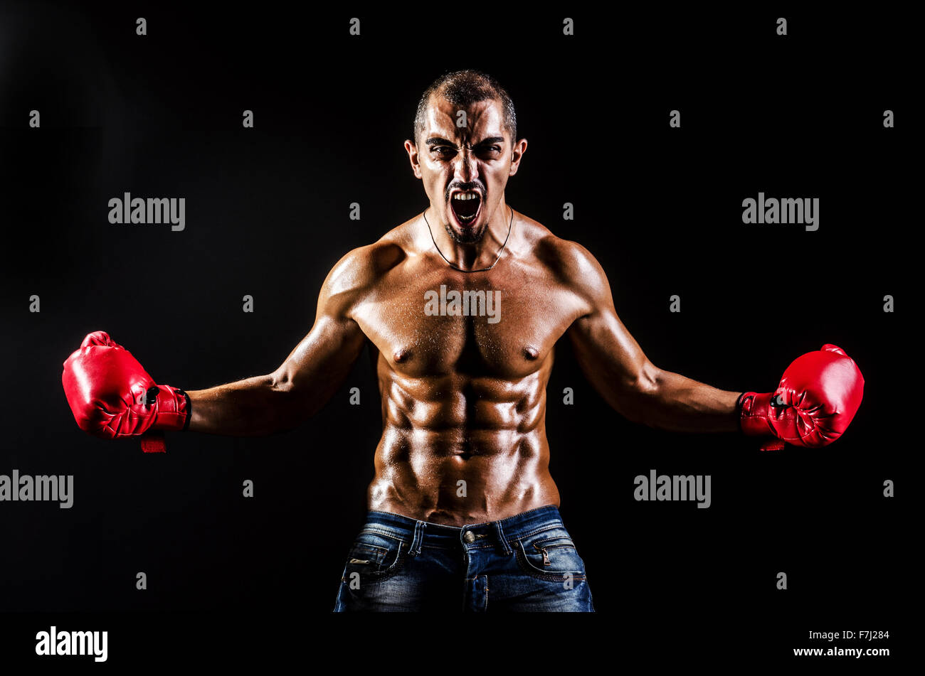 Young man with boxing gloves Stock Photo - Alamy