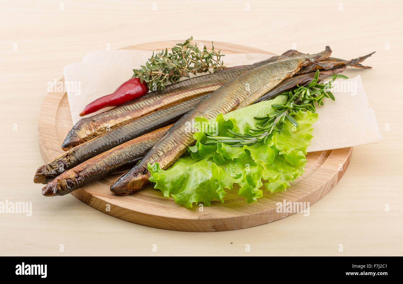 Smoked Lamprey - seafood delicacy with salad and herbs Stock Photo - Alamy