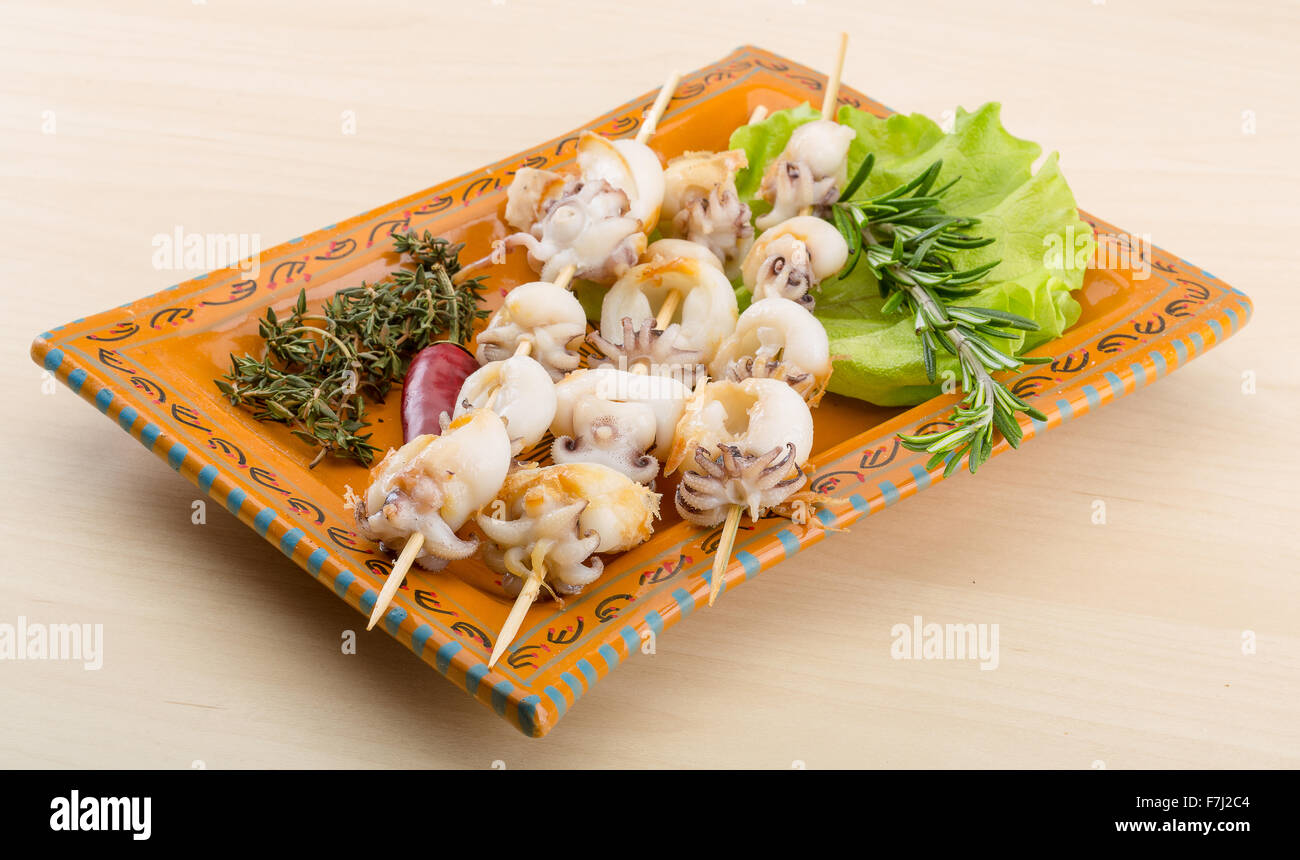 Grilled cuttlefish bbq with rosemary and pepper Stock Photo - Alamy